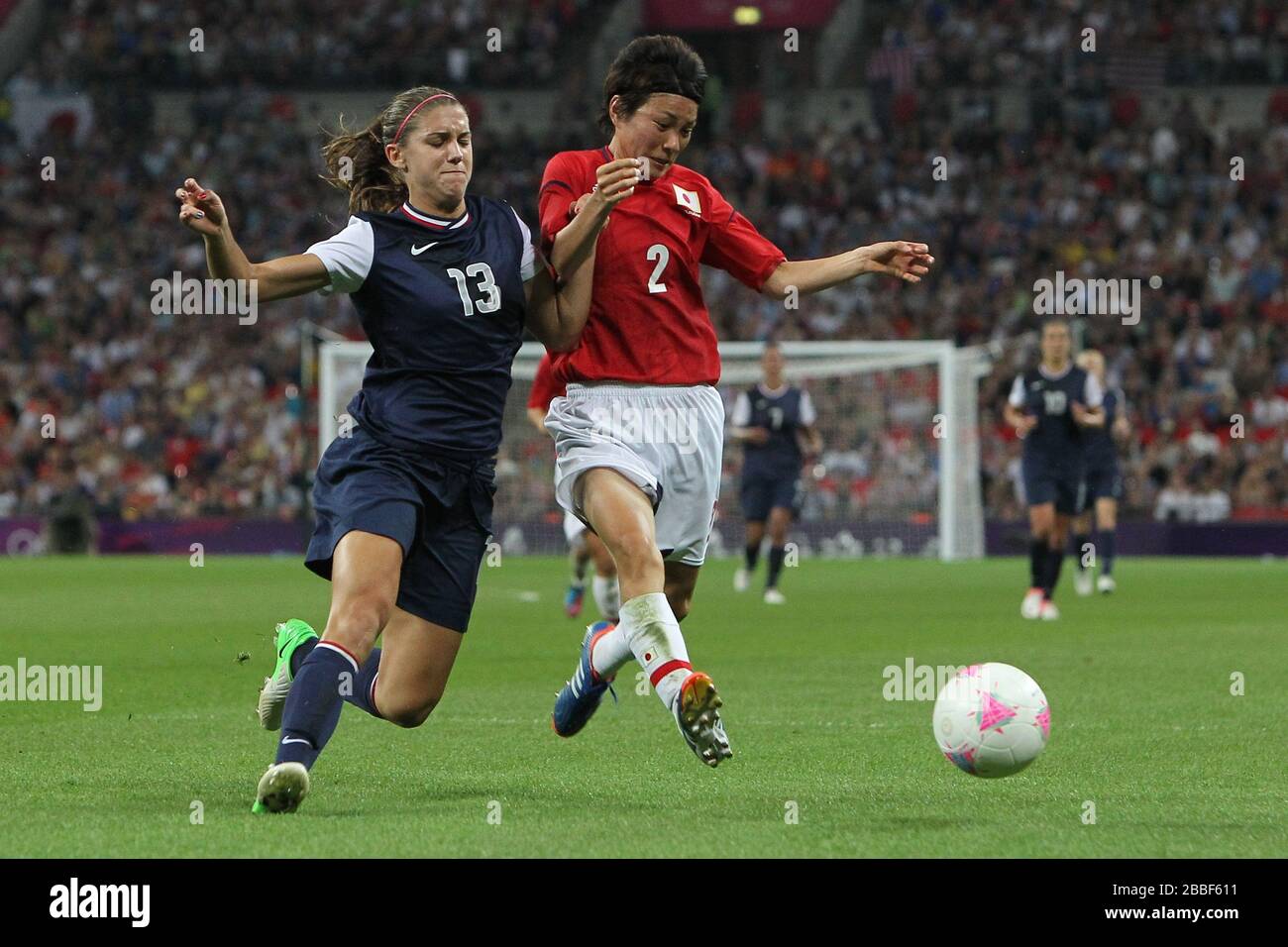 Alex MORGAN of USA tangles with Yukari KINGA of Japan during the Final ...