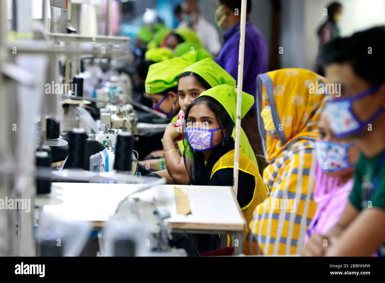 Dhaka, Bangladesh - March 31, 2020: Workers producing personal ...