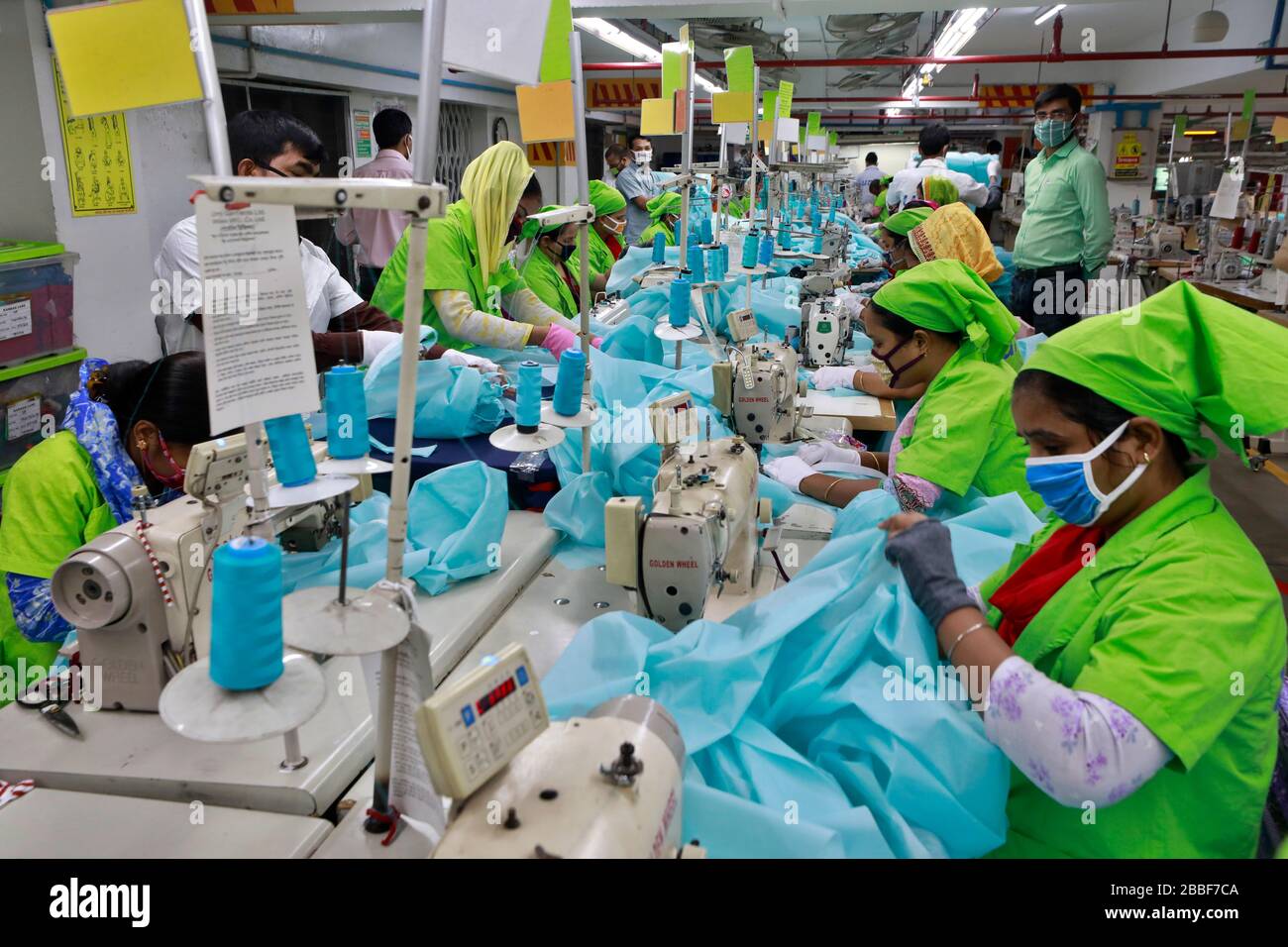 Dhaka, Bangladesh - March 31, 2020: Workers producing personal ...
