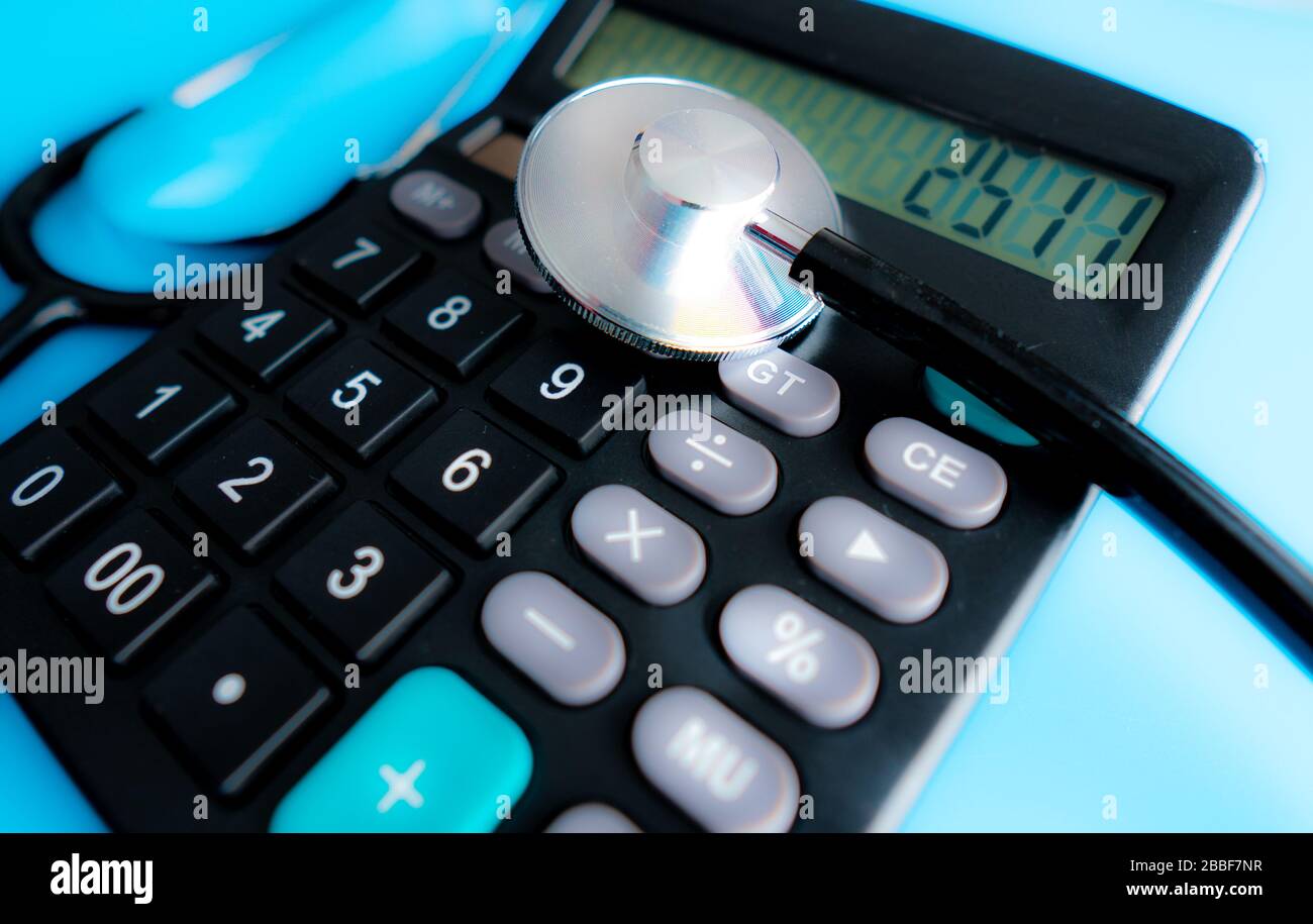 Calculator and stethoscope on financial statement concept for finance ...
