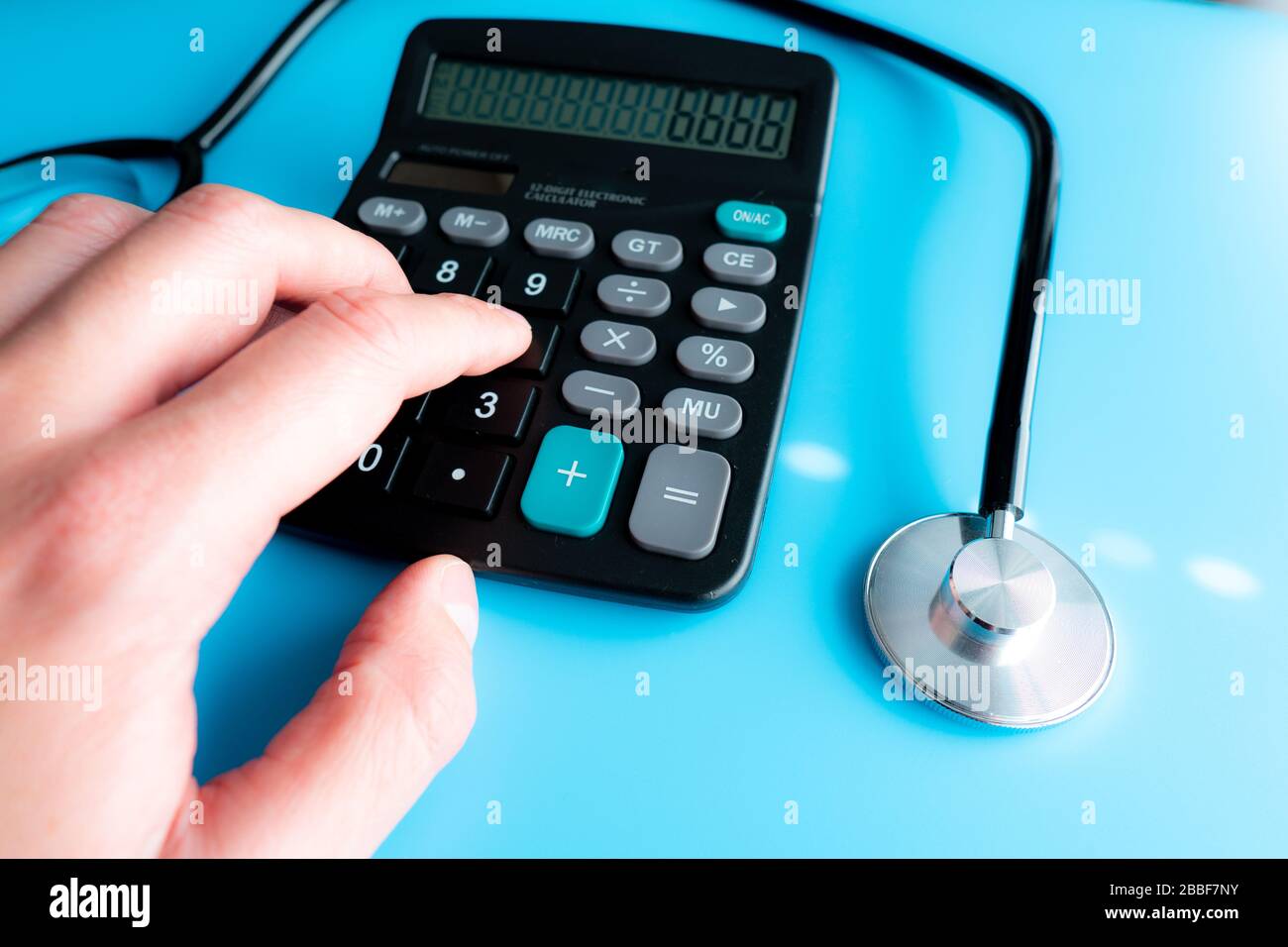 Calculator and stethoscope on financial statement concept for finance ...