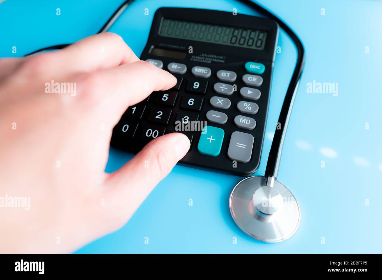 Calculator and stethoscope on financial statement concept for finance ...