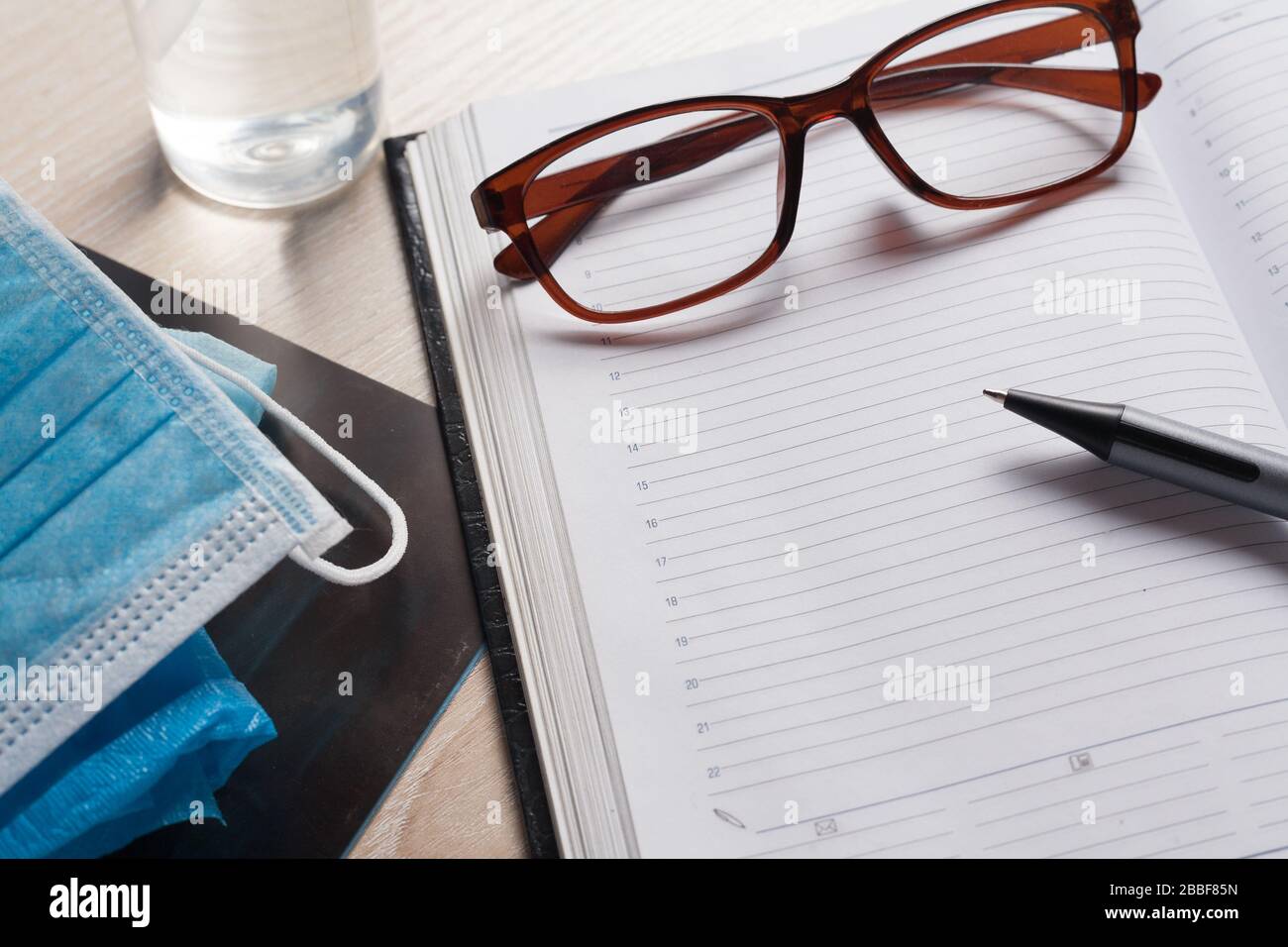 Empty notepad on hospital desk surrounded by medical equipment. Top ...