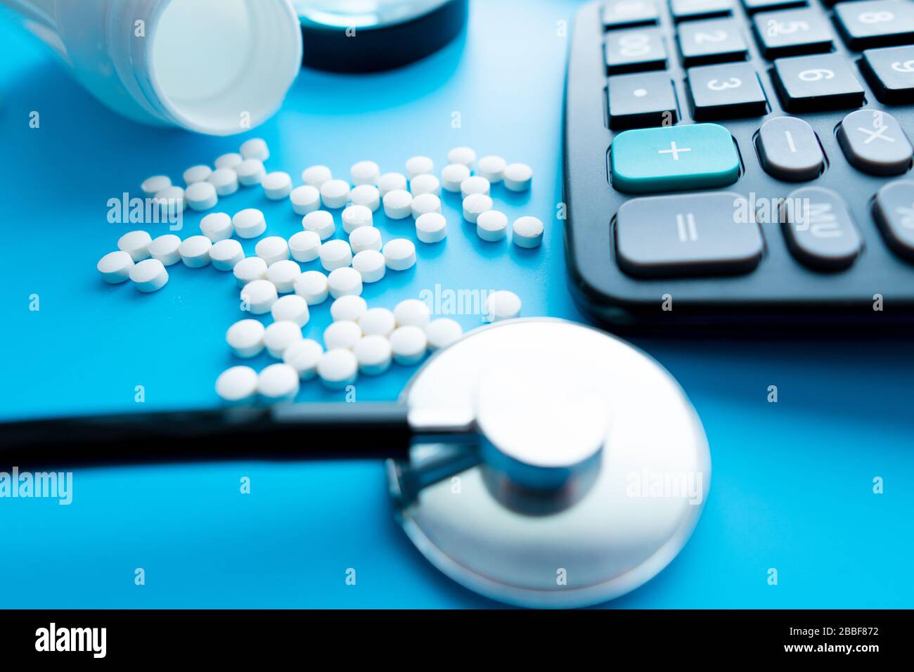 flat lay medical composition. Economic analysis. Calculator with ...