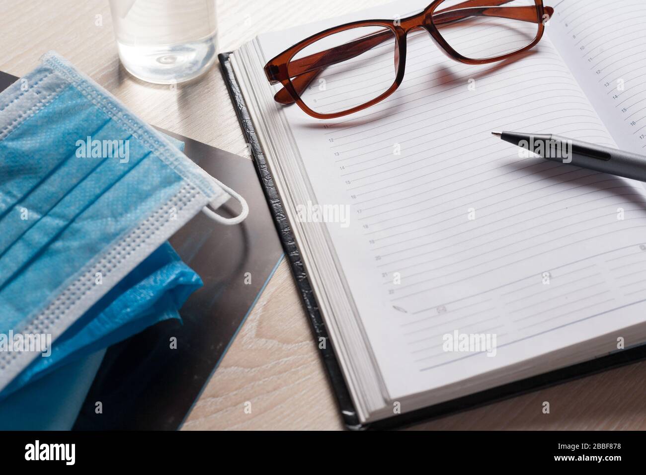 Empty notepad on hospital desk surrounded by medical equipment. Top ...