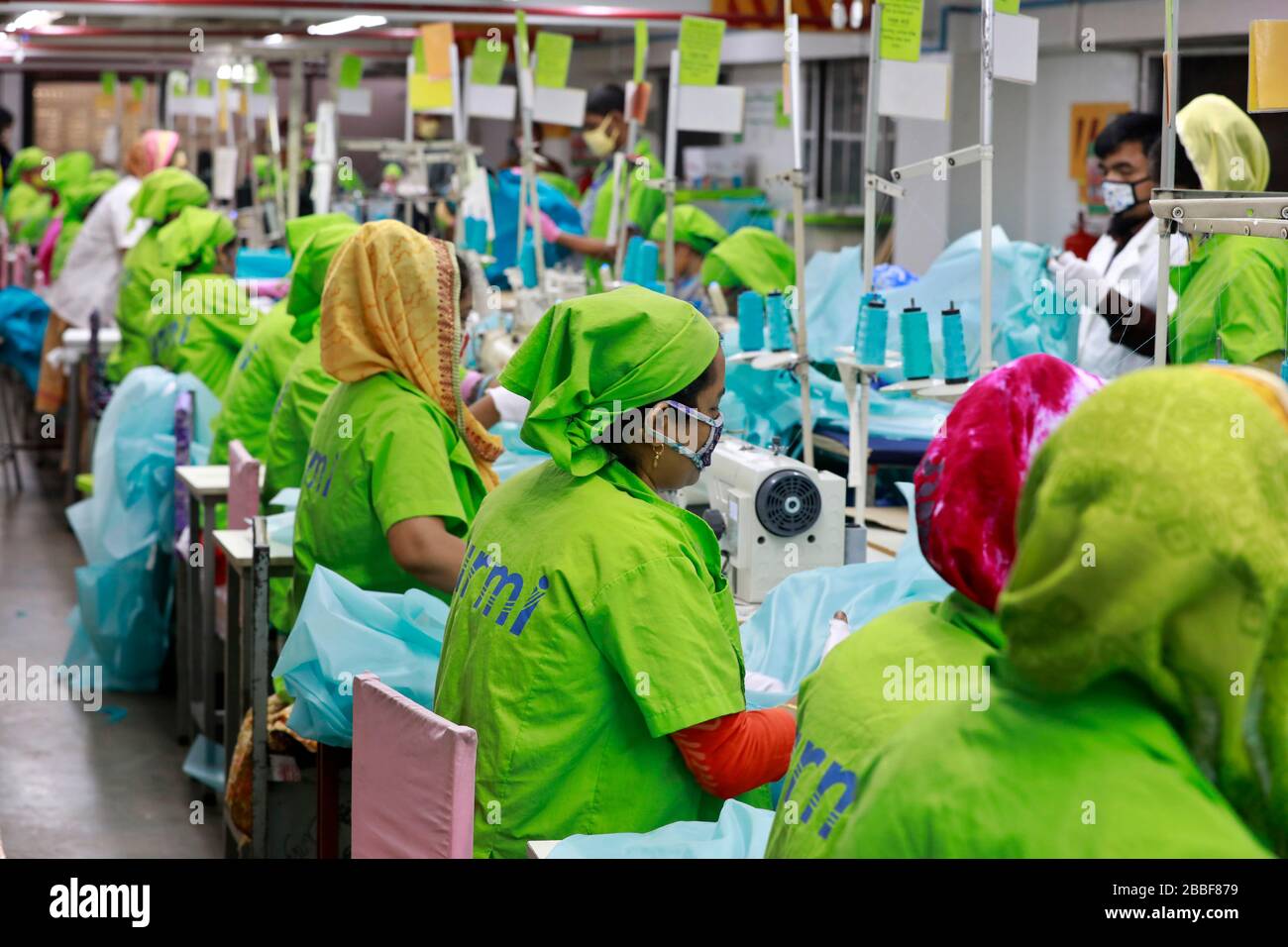 Dhaka, Bangladesh - March 31, 2020: Workers producing personal ...