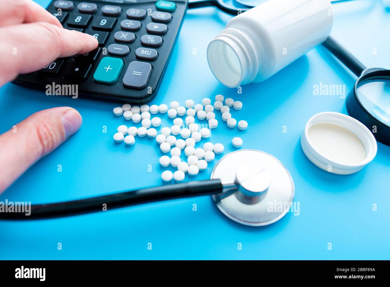 flat lay medical composition. Economic analysis. Calculator with ...