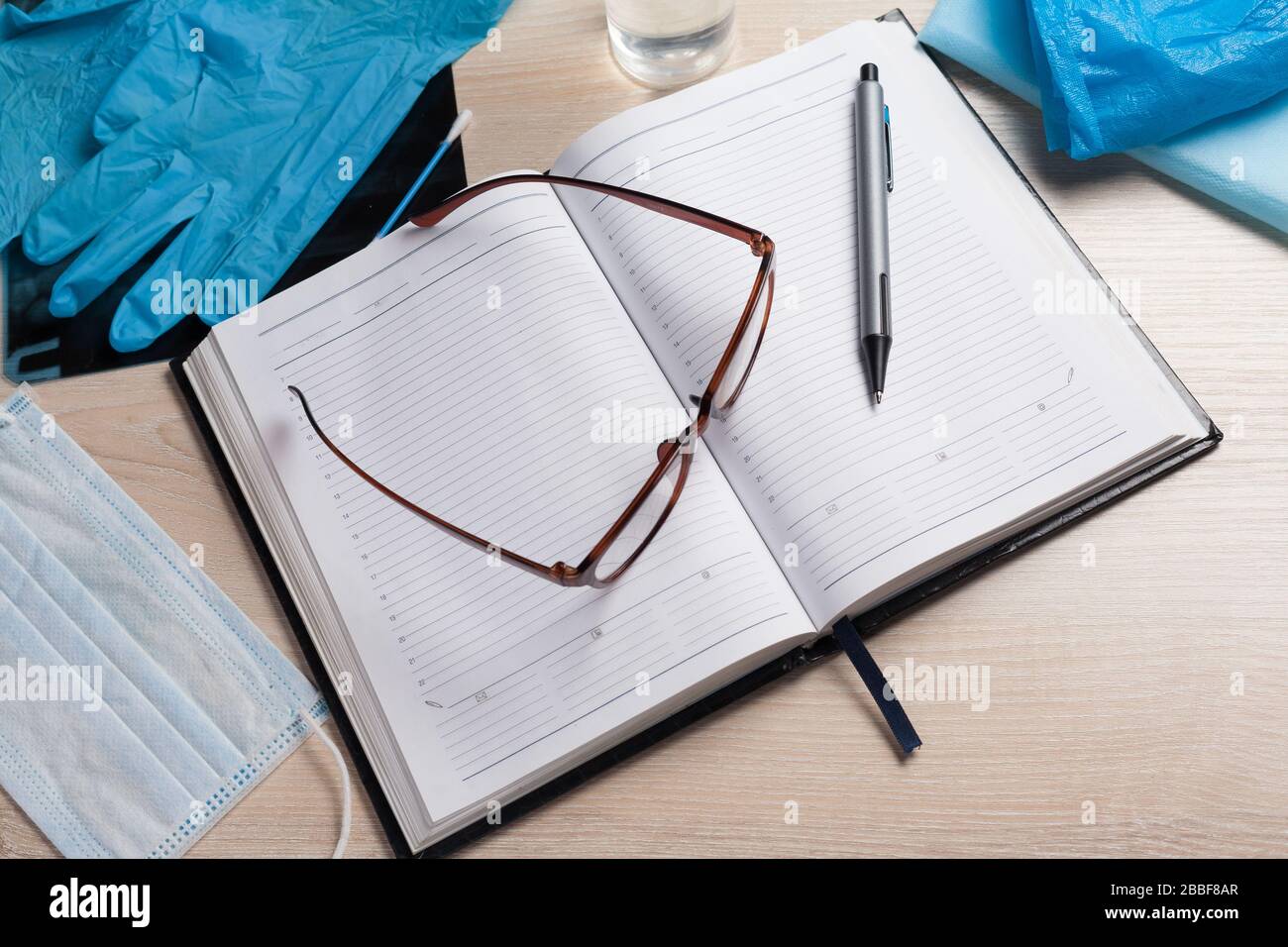 Empty notepad on hospital desk surrounded by medical equipment. Top ...