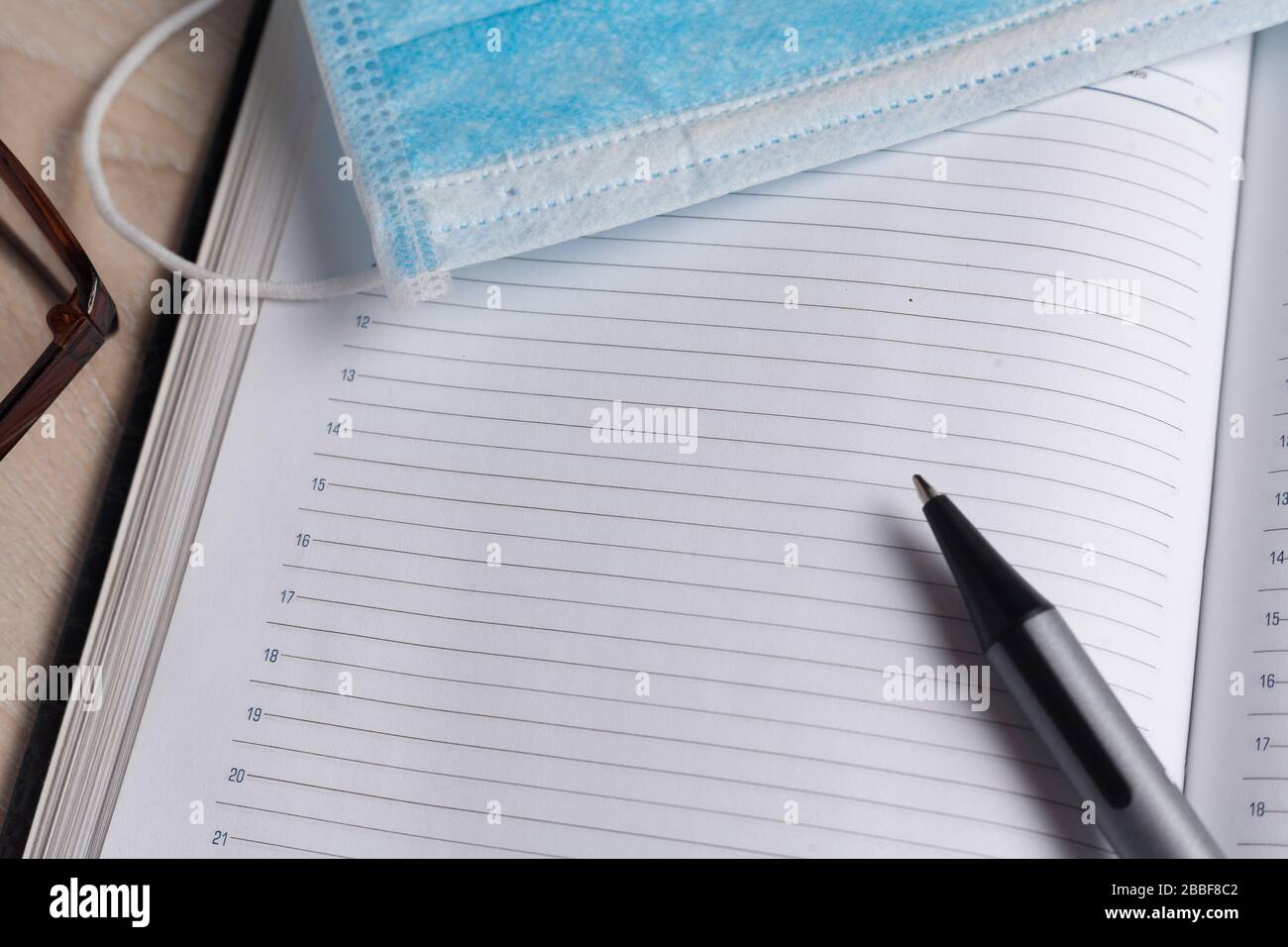 Empty notepad on hospital desk surrounded by medical equipment. Top ...