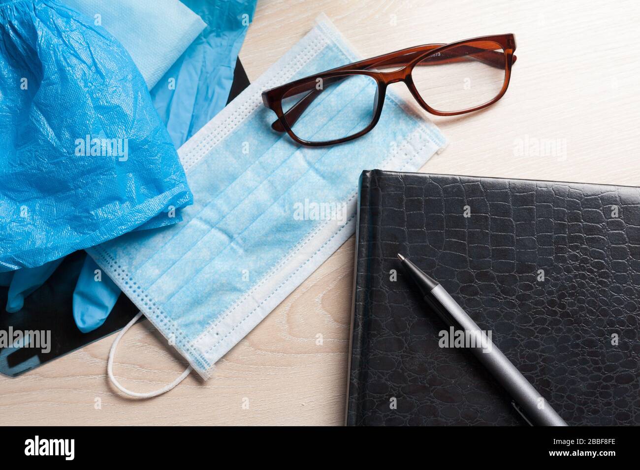 Empty notepad on hospital desk surrounded by medical equipment. Top ...