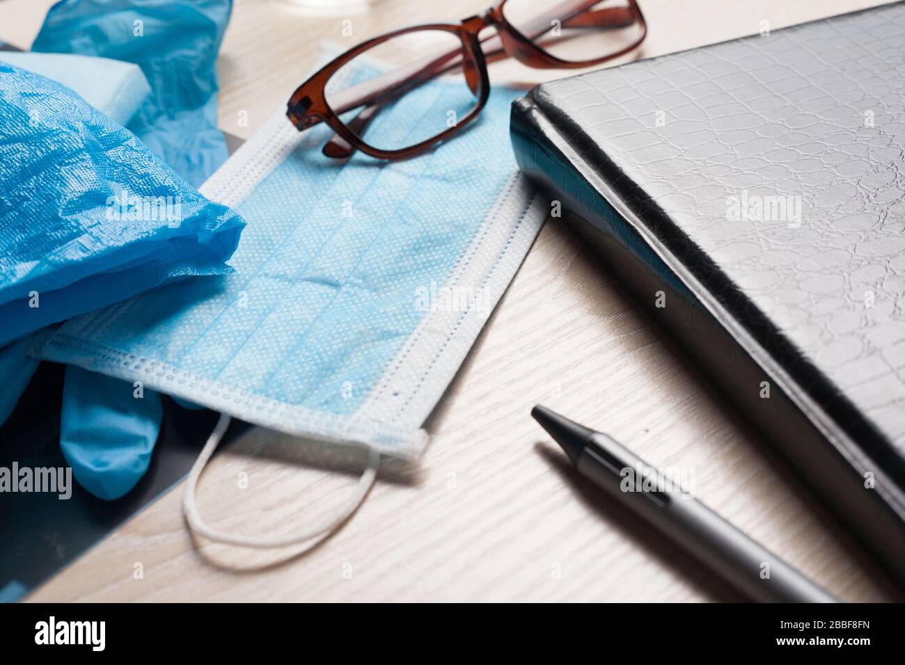 Empty notepad on hospital desk surrounded by medical equipment. Top ...