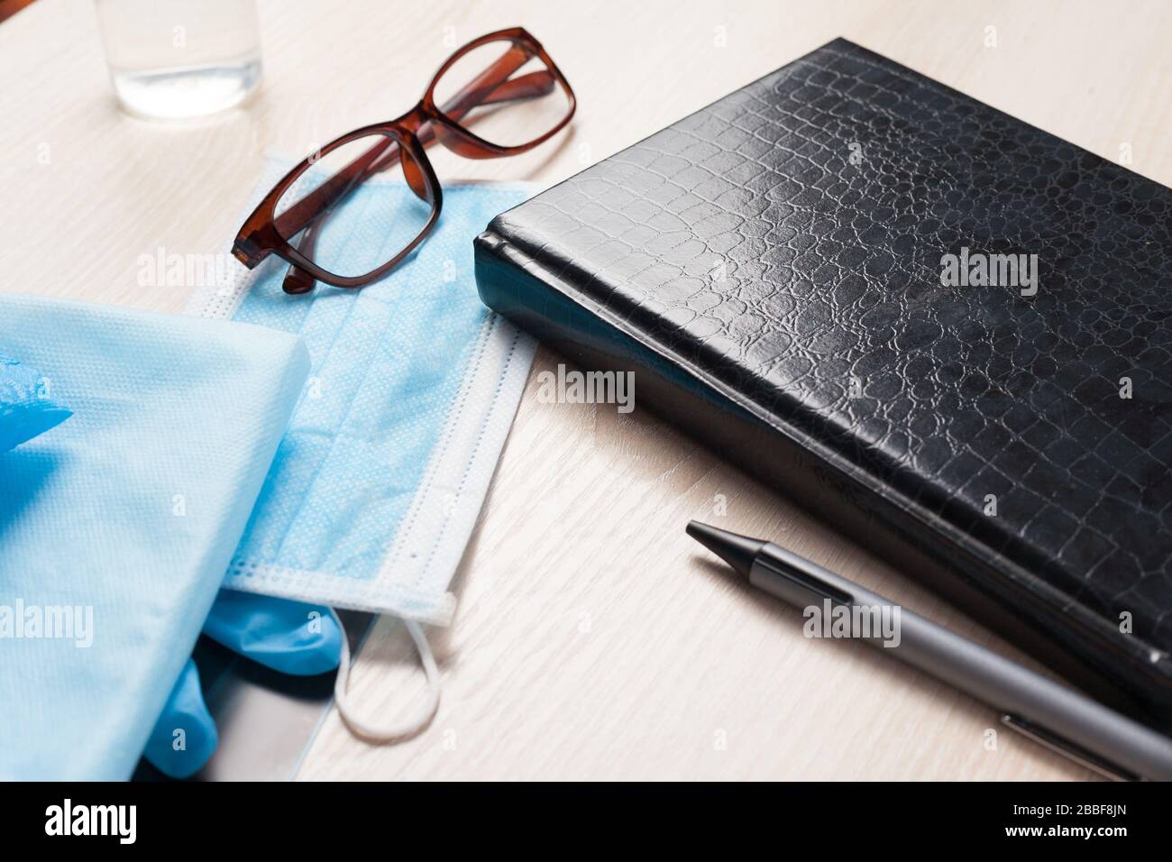 Empty notepad on hospital desk surrounded by medical equipment. Top ...