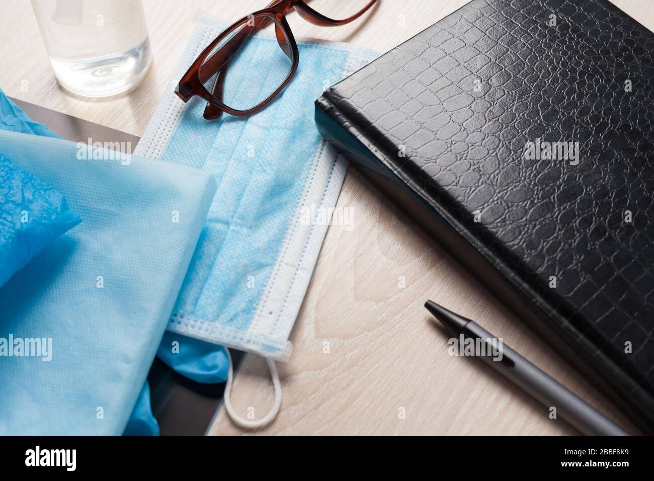 Empty notepad on hospital desk surrounded by medical equipment. Top ...