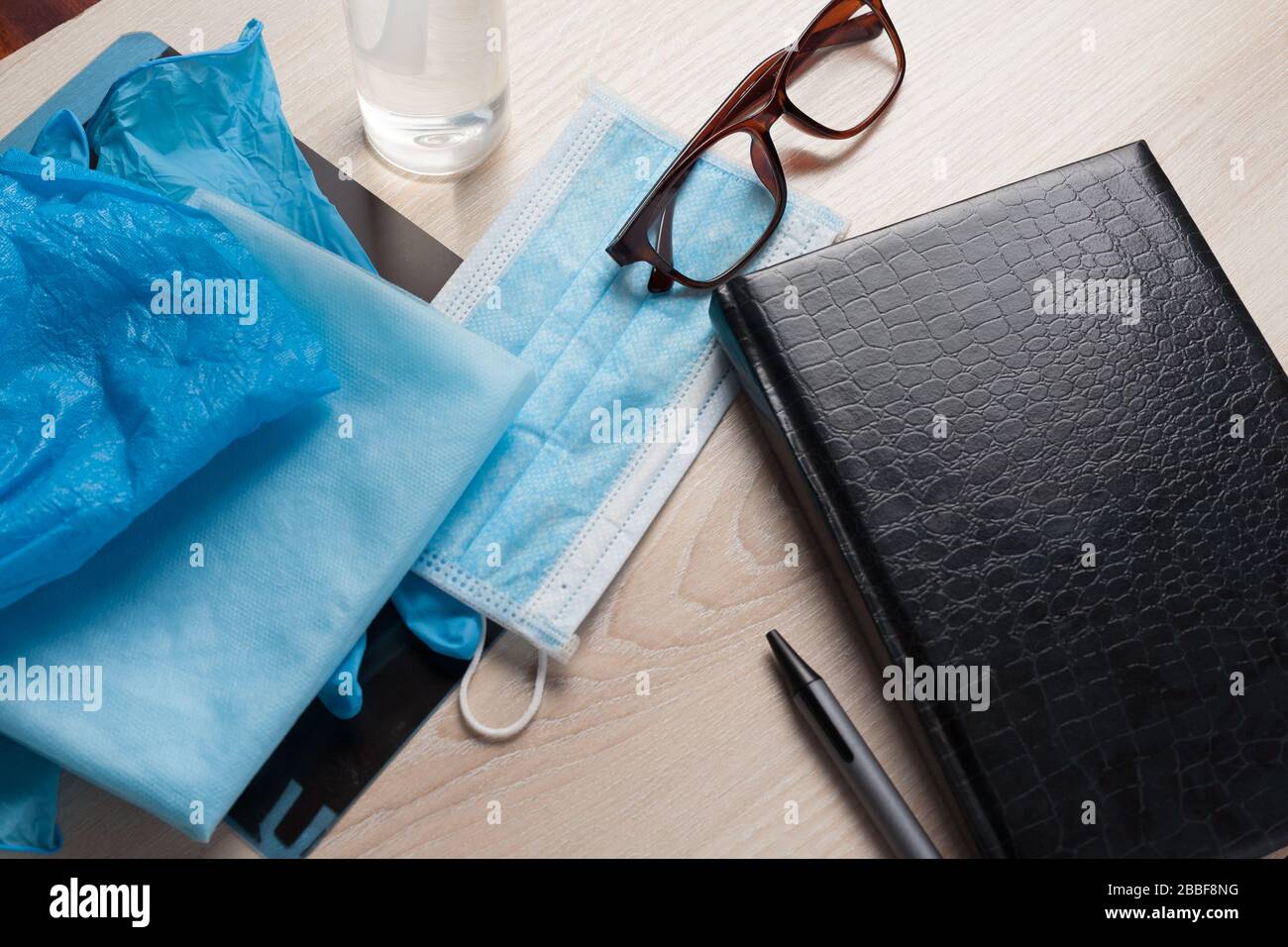 Empty notepad on hospital desk surrounded by medical equipment. Top ...
