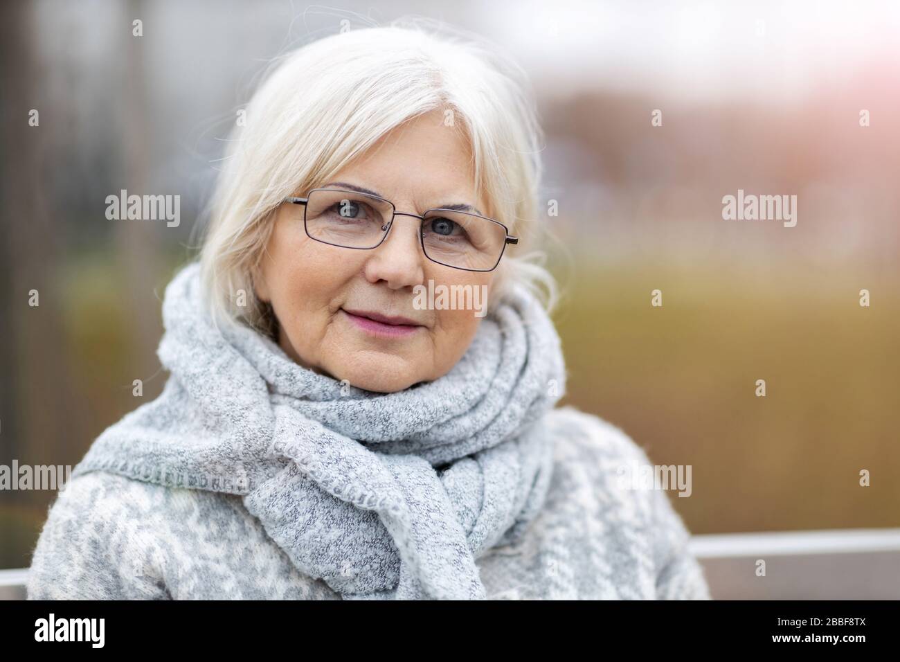 Portrait of senior woman smiling Stock Photo - Alamy
