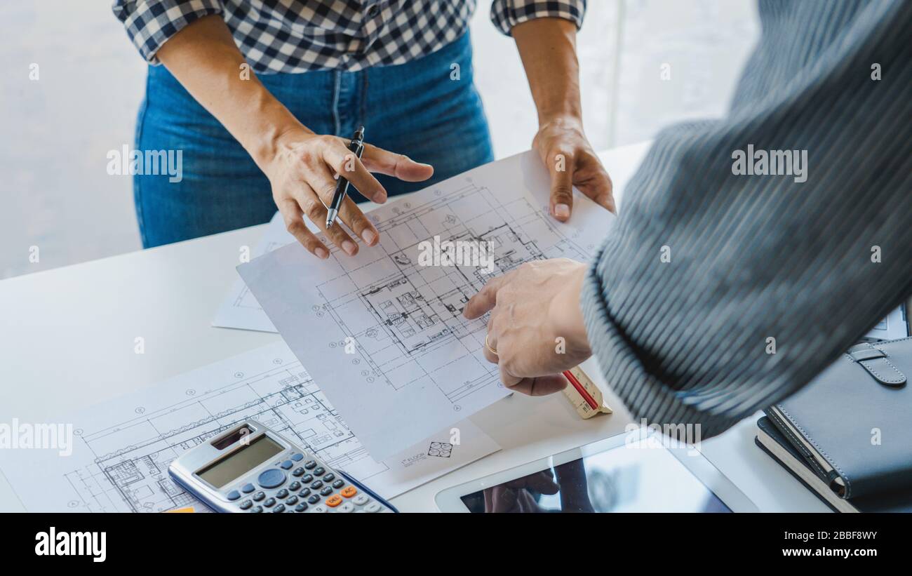 engineer Hand Drawing Plan On Blue Print with architect equipment ...