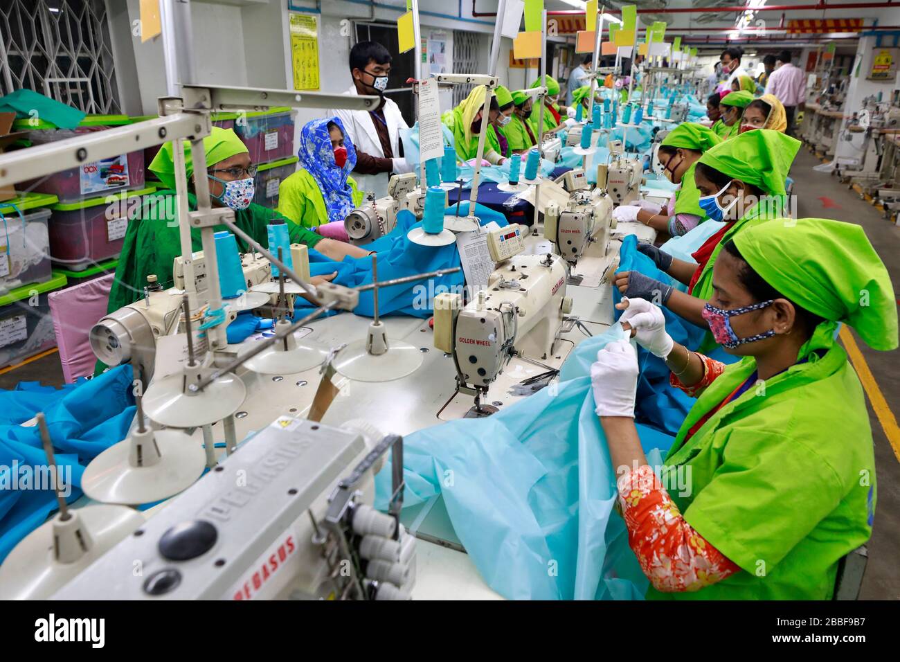 Dhaka, Bangladesh - March 31, 2020: Workers producing personal ...