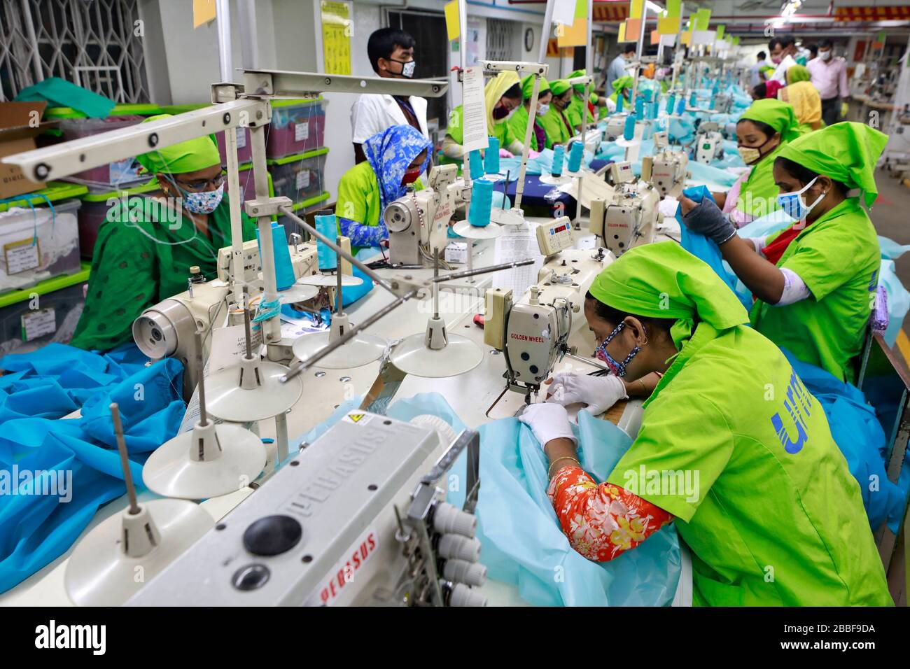 Dhaka, Bangladesh - March 31, 2020: Workers producing personal ...