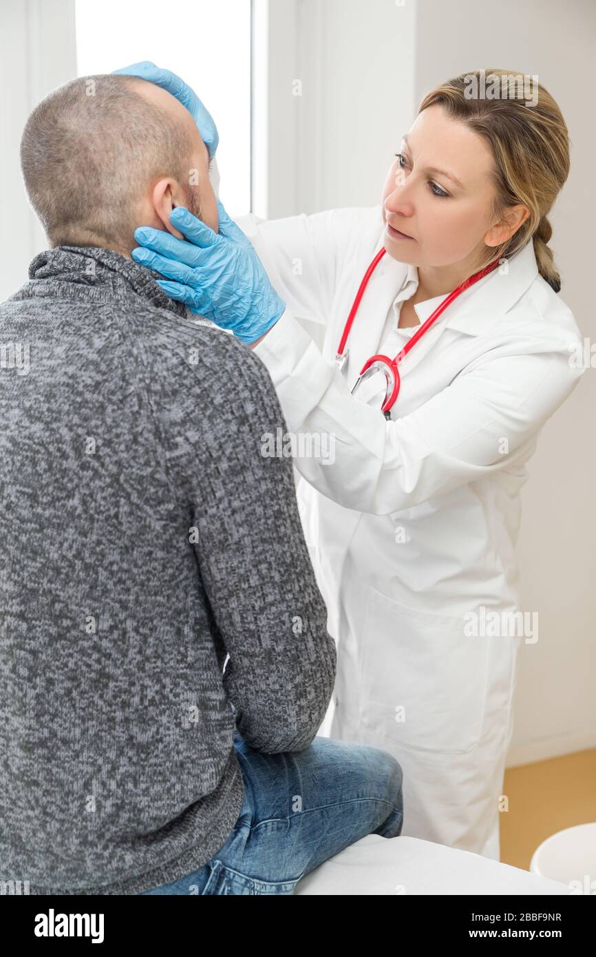 female doctor is doing a examination with a male patient, corona virus ...