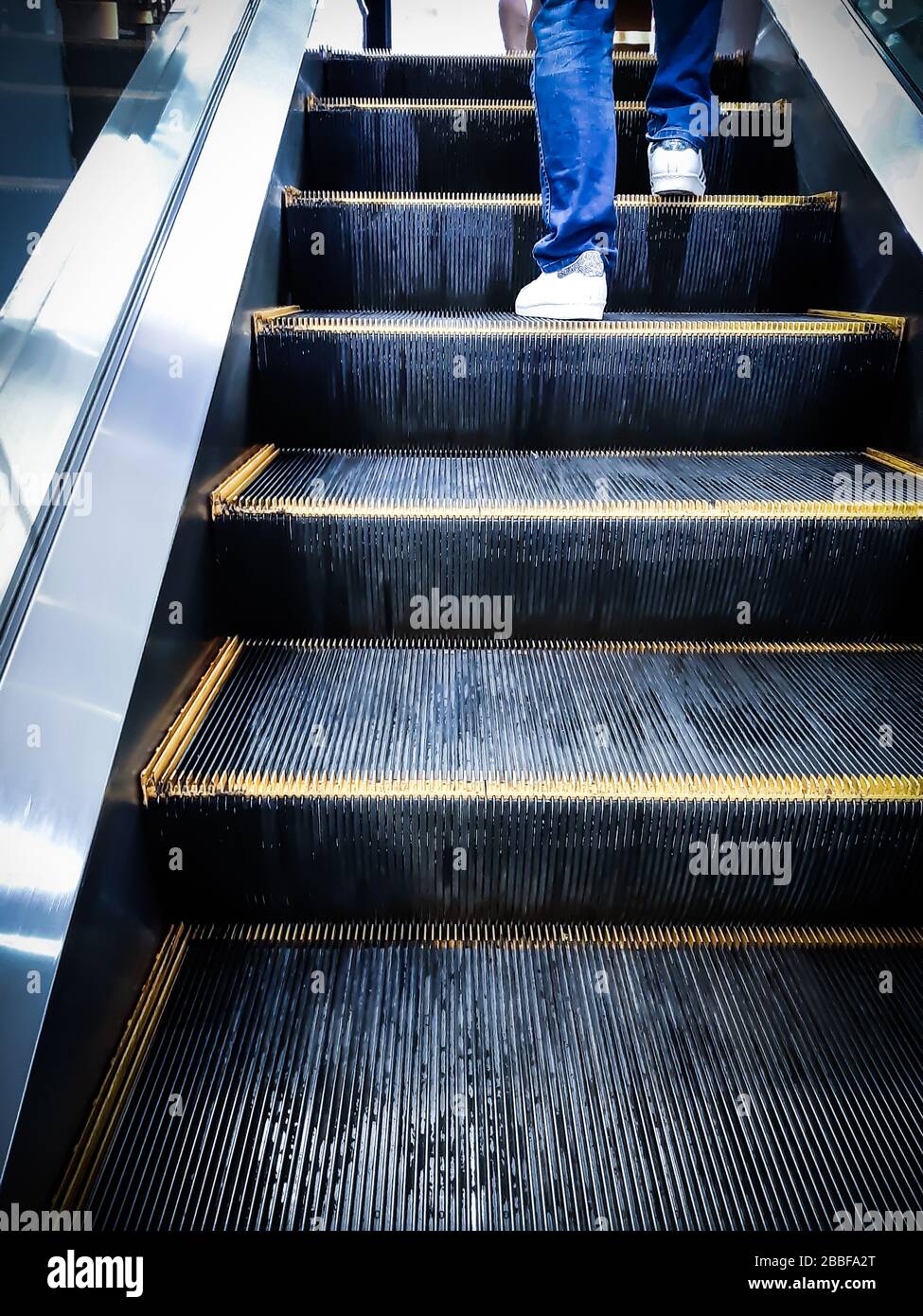 People walking up the escalators, Modern escalator electronic system ...