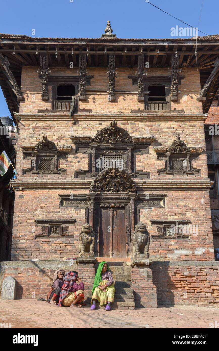 Bhaktapur, Nepal - 28 January 2020: people sitting in front of a ...