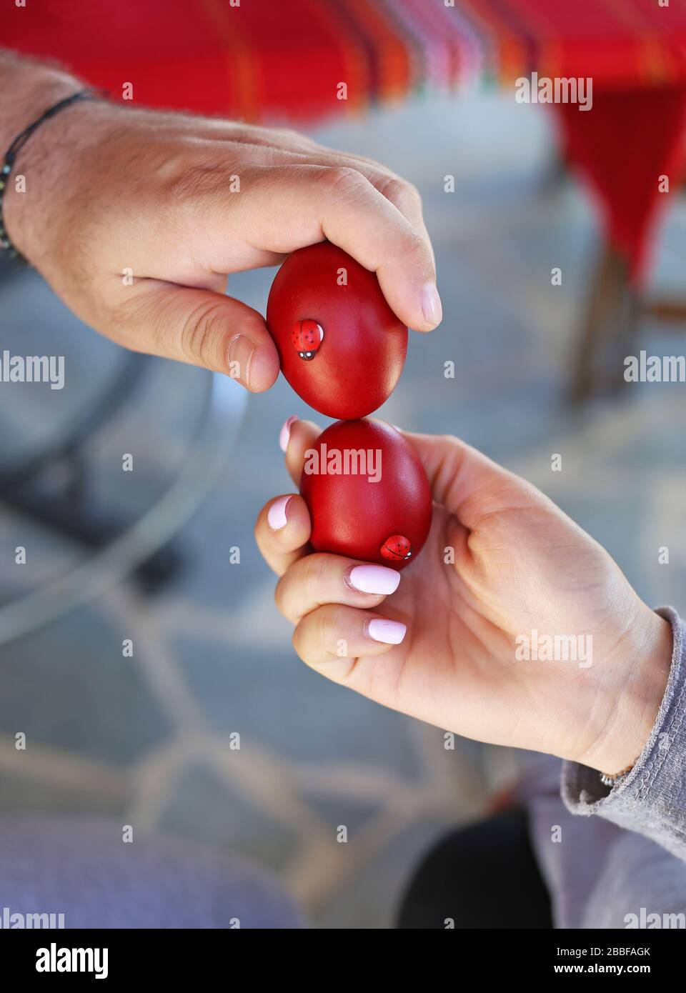 hands holding cracked red Easter eggs - Orthodox greek tradition of ...