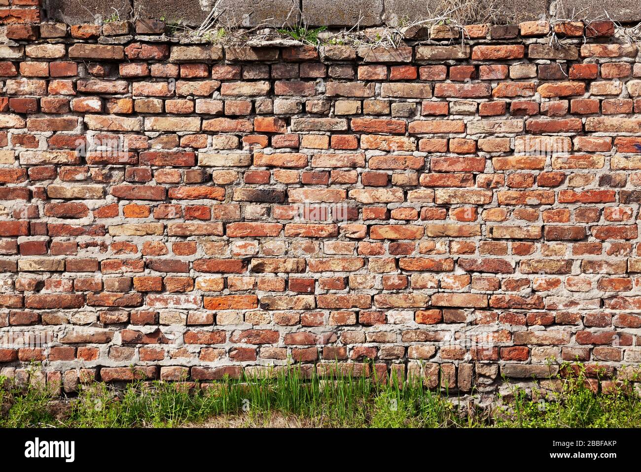 The dilapidated old brick wall made of red brick Stock Photo - Alamy