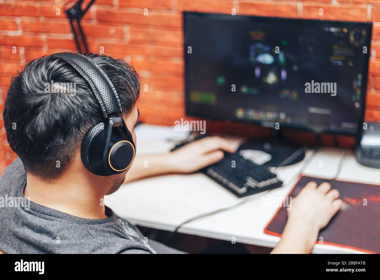 young man playing game on computer, banner Stock Photo - Alamy