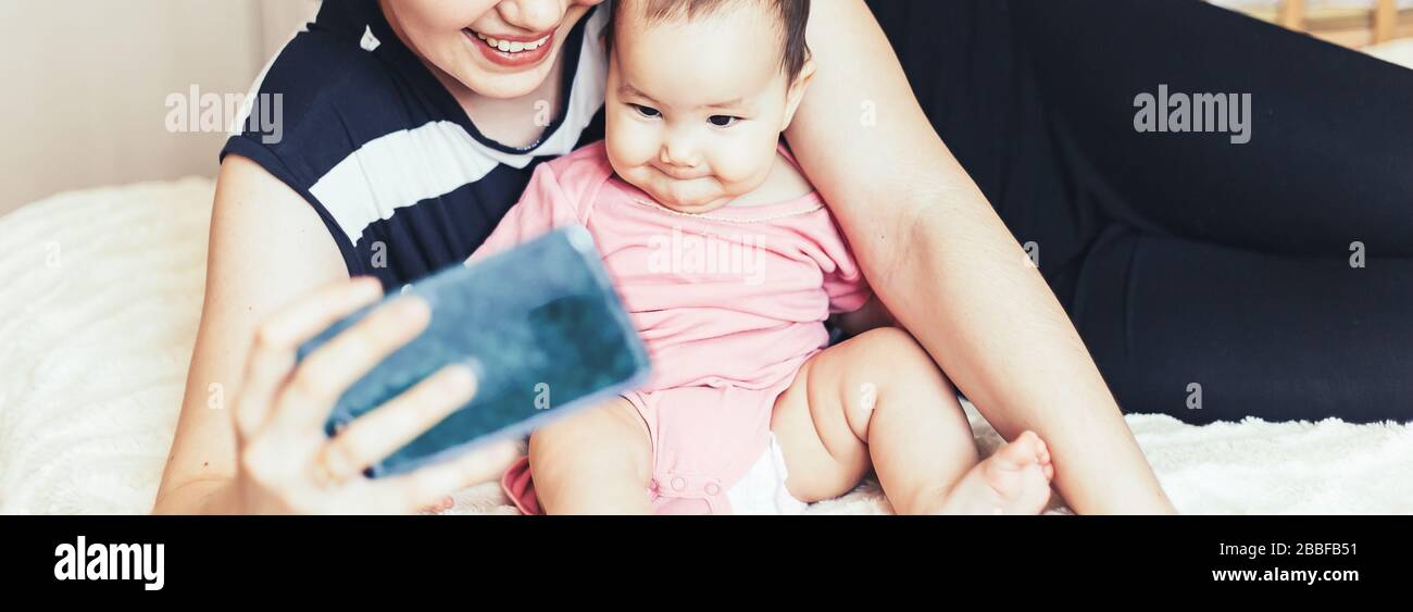 young mother is making selfie with her adorable little baby girl Stock ...