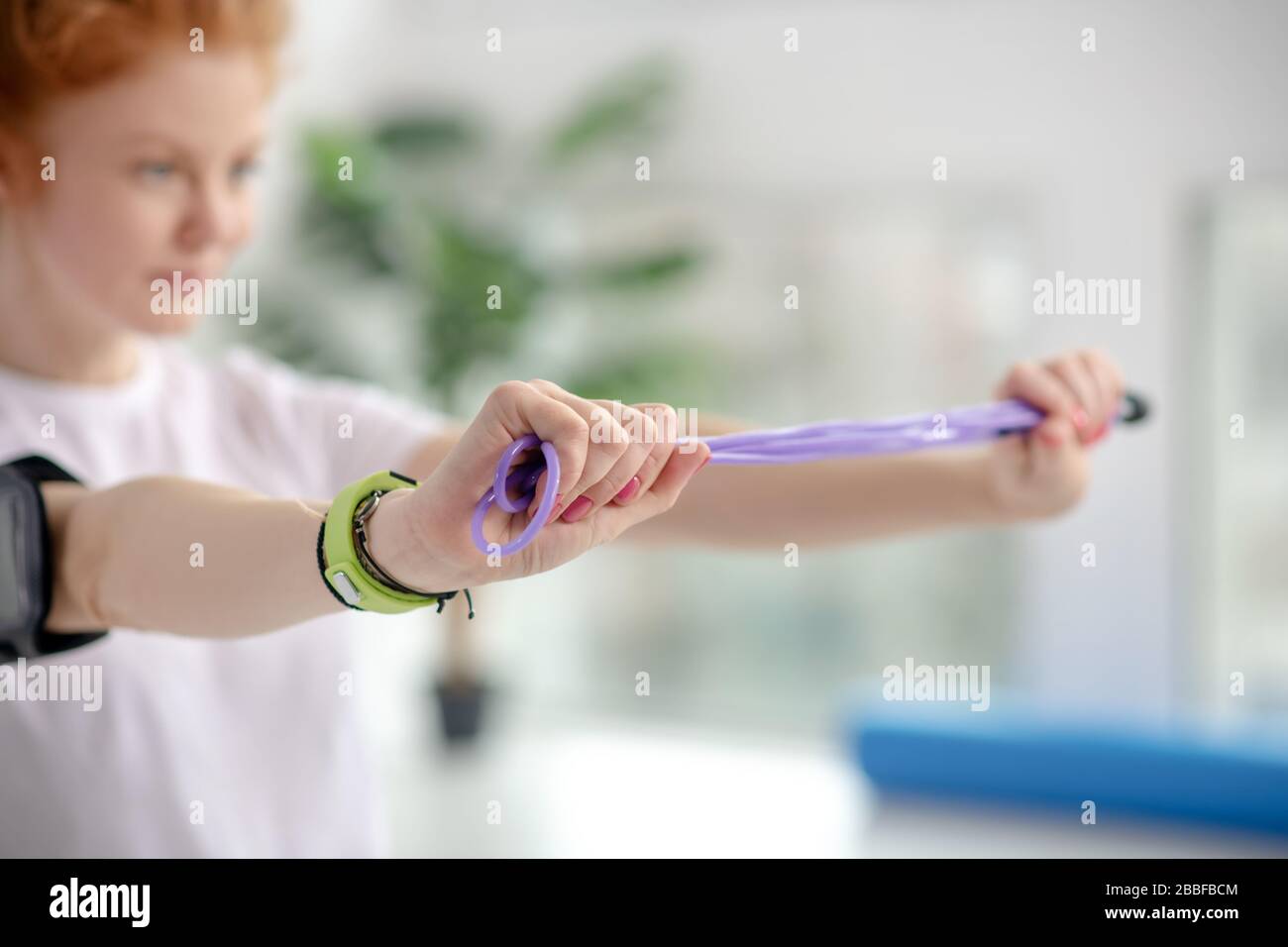 Female patient stretching jump rope with hands Stock Photo - Alamy