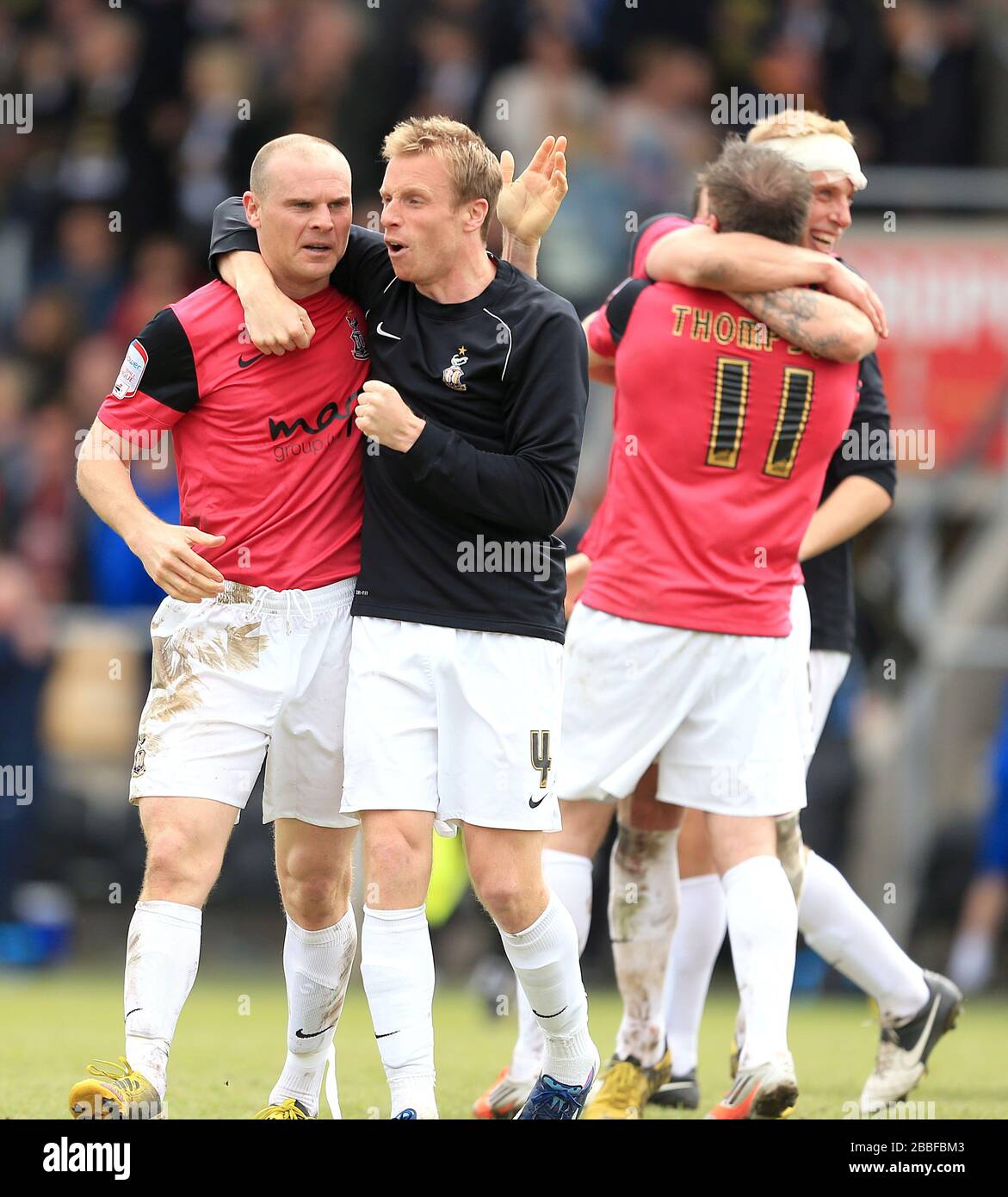 Bradford City's Gary Jones (left) celebrates on the pitch with teammate ...