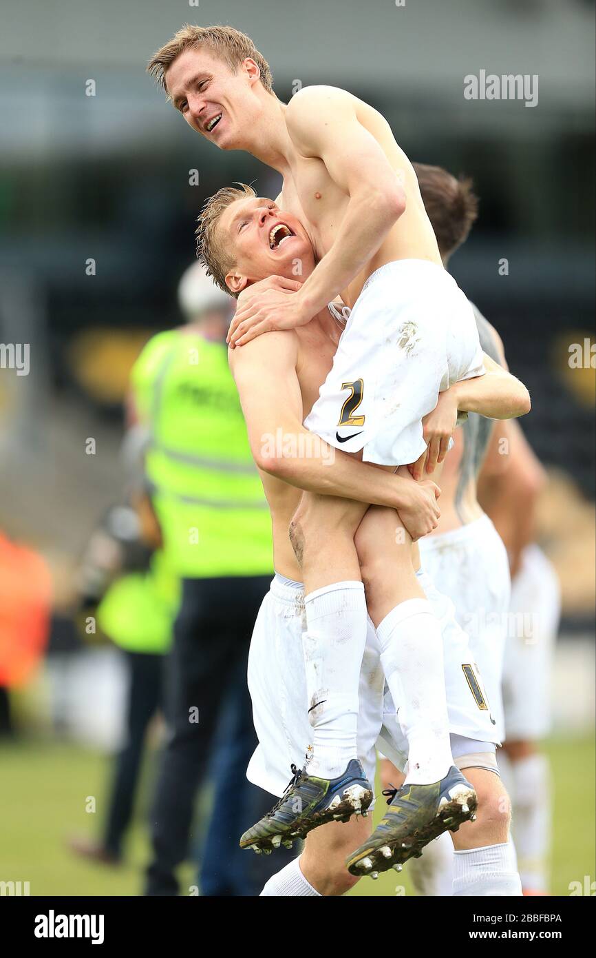 Bradford City's Alan Connell (left) holds his teammate Stephen Darby ...