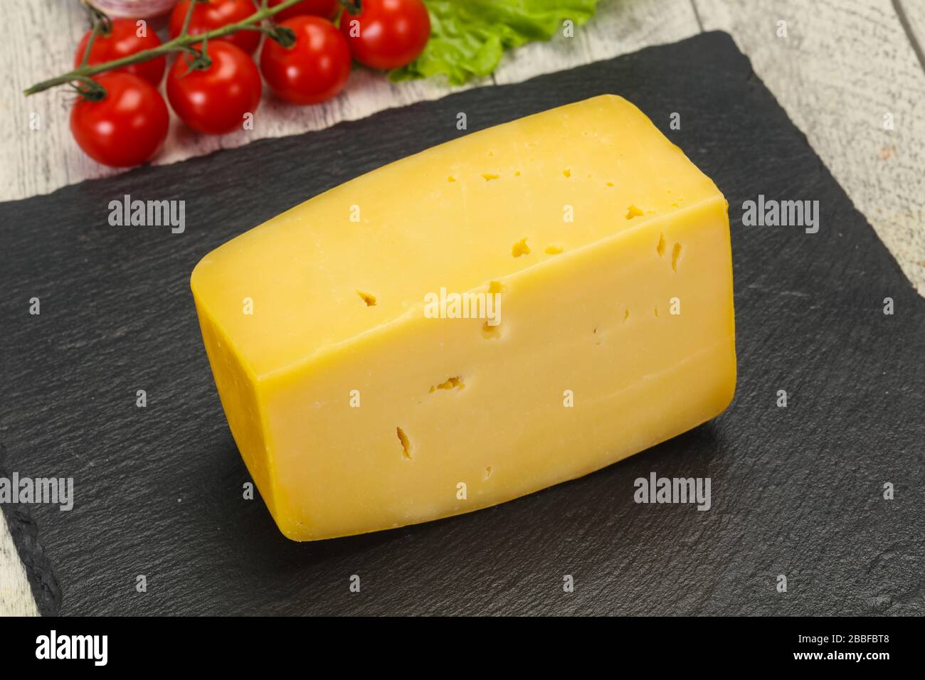 Swiss Hard yellow tasty cheese brick Stock Photo - Alamy