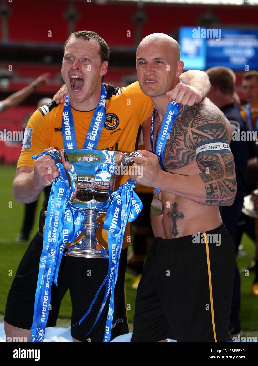 Newport County's Michael Flynn and captain David Pipe (right) celebrate ...