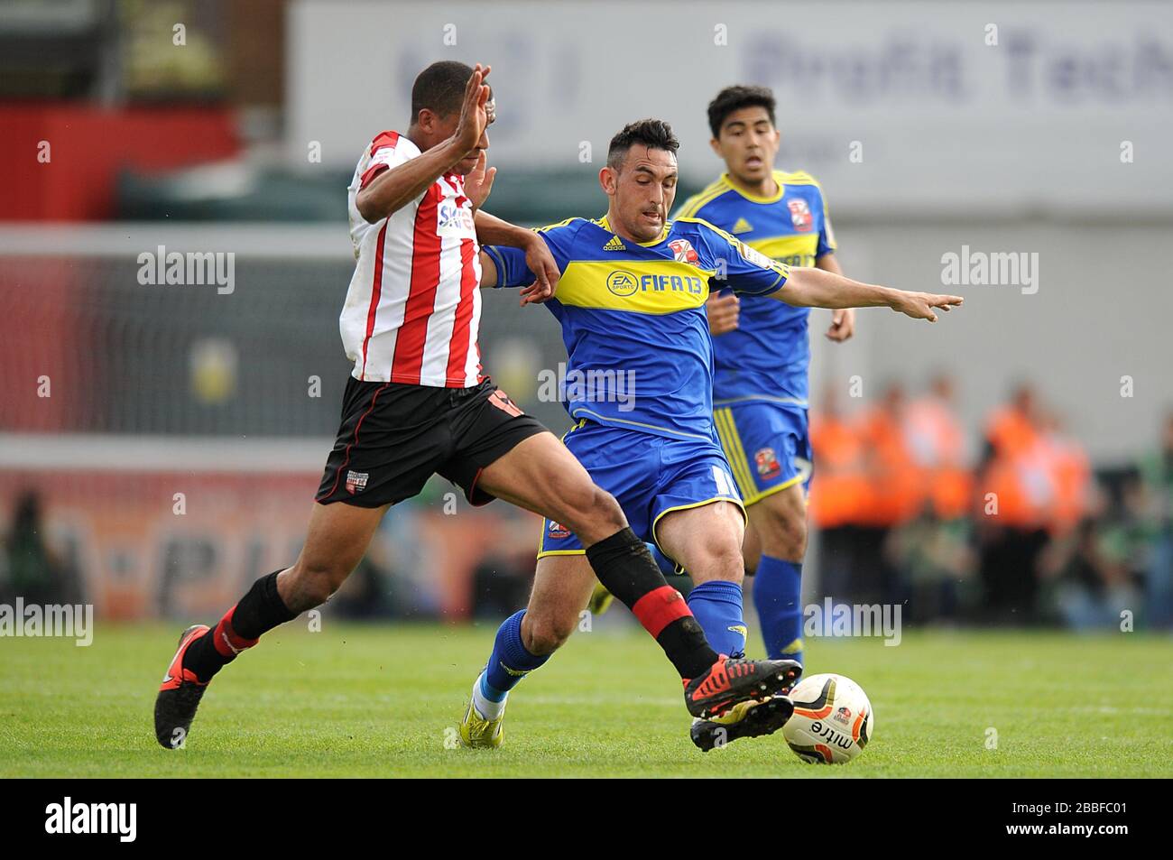 Brentford's Tom Adeyemi (left) and Swindon Town's Gary Roberts (right ...