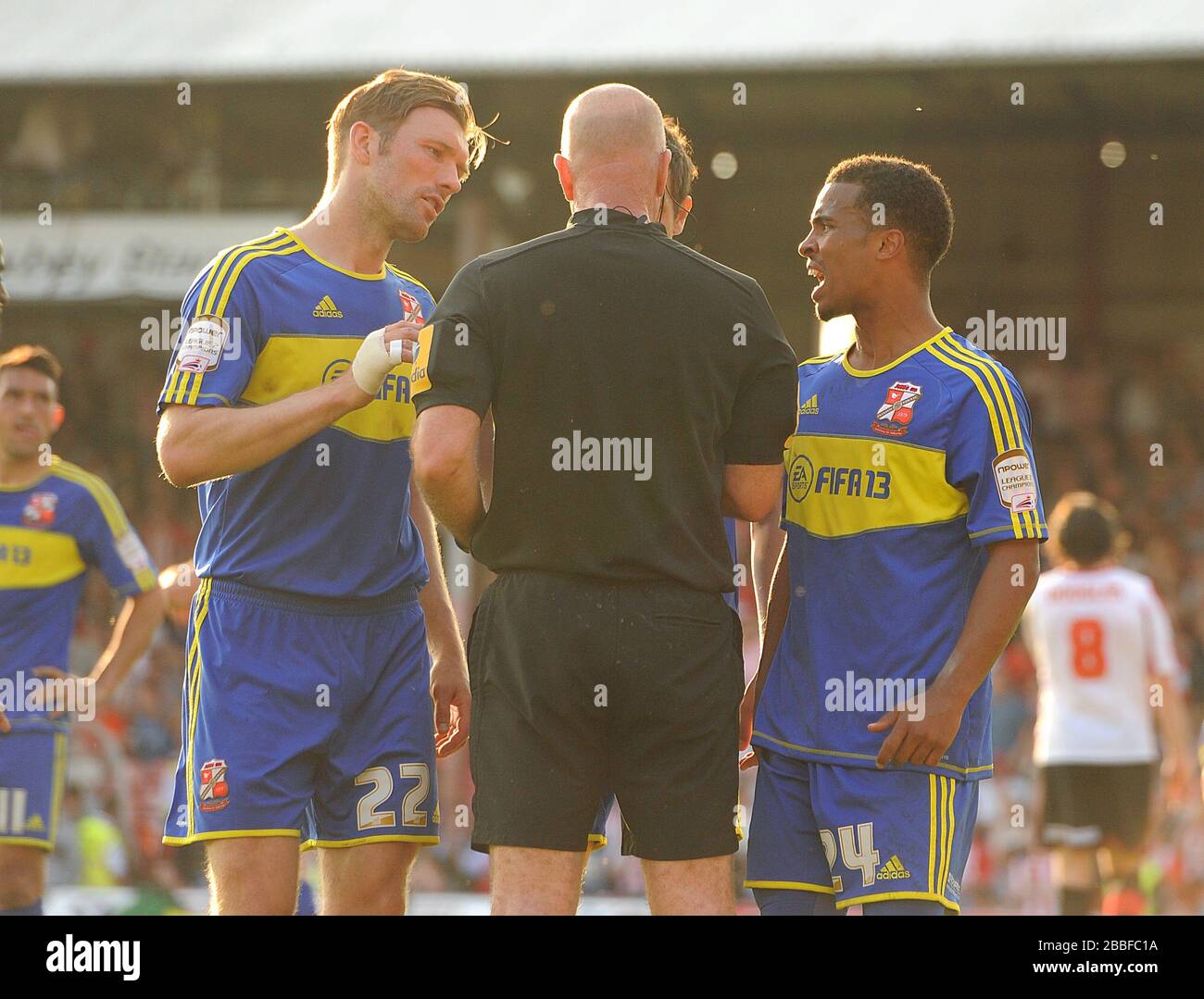 Swindon Town's Nathan Byrne (right) reacts as he is shown a red card by ...