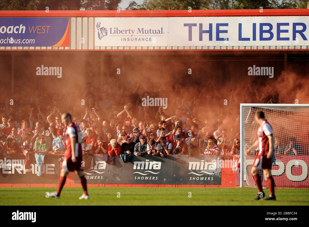 Fans let off a flare in the stands Stock Photo - Alamy