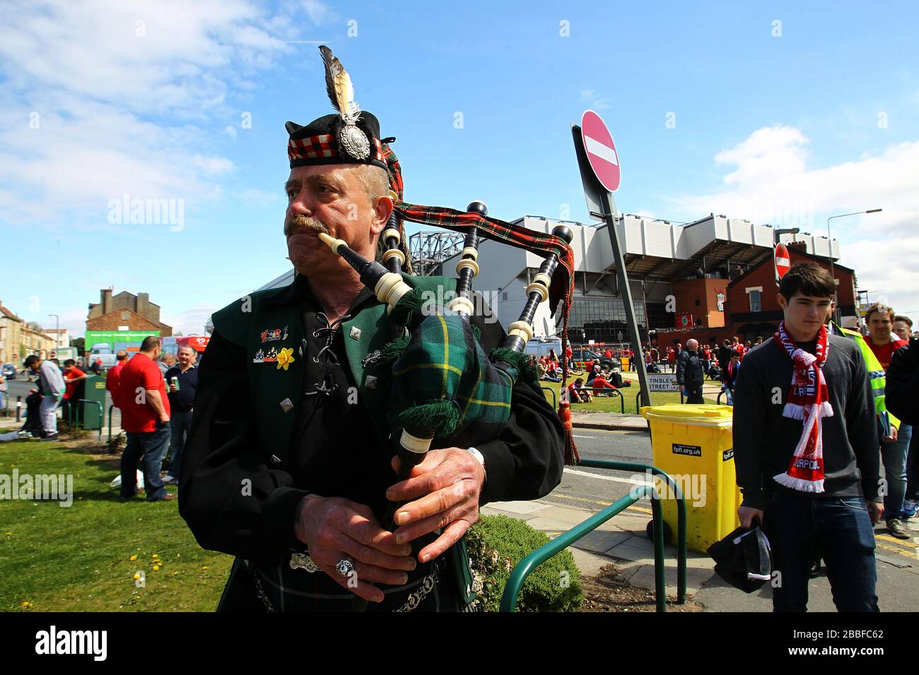 A bagpipe player outside the ground Stock Photo - Alamy