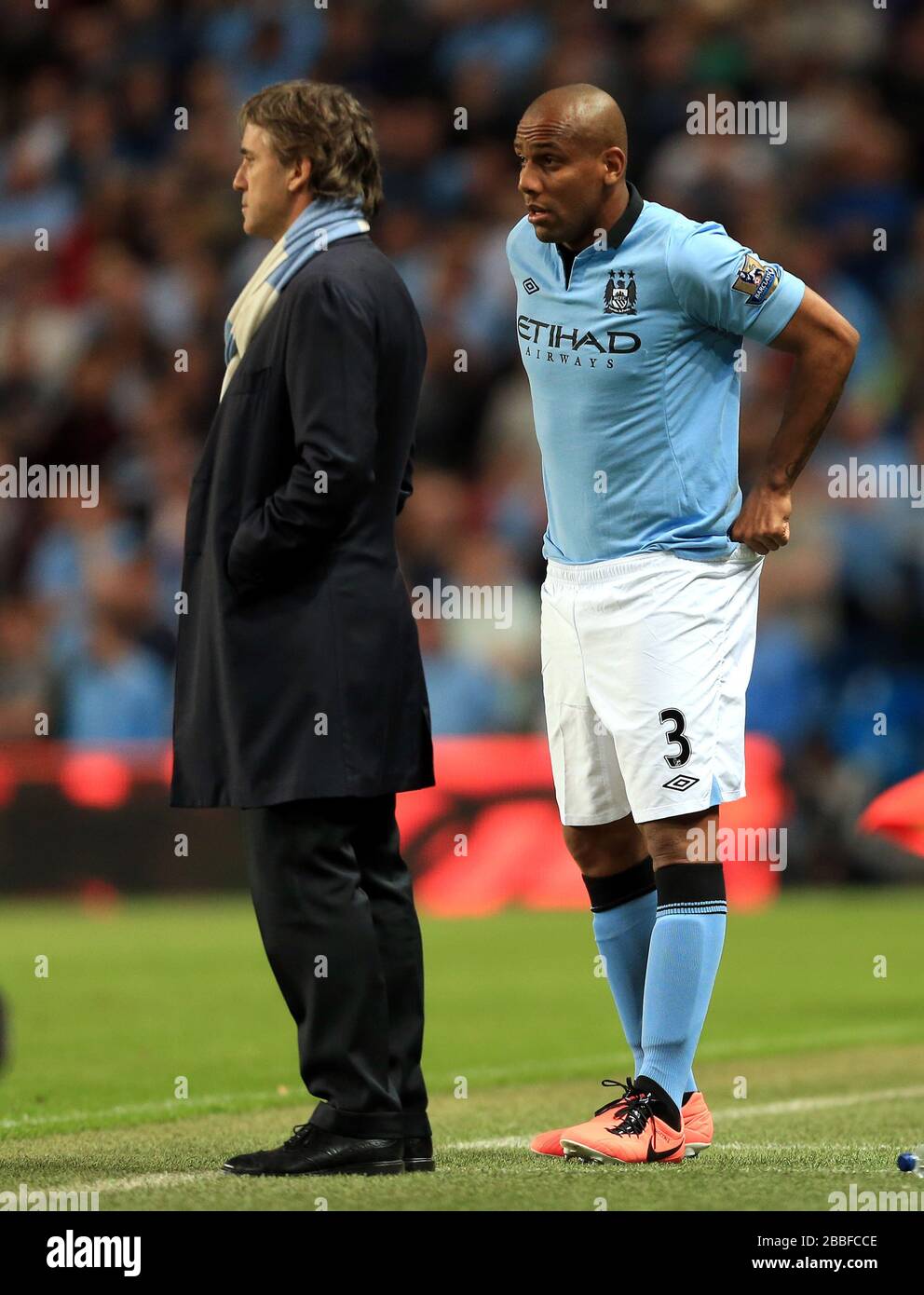 Manchester City's manager Roberto Mancini alongside Maicon Stock Photo ...