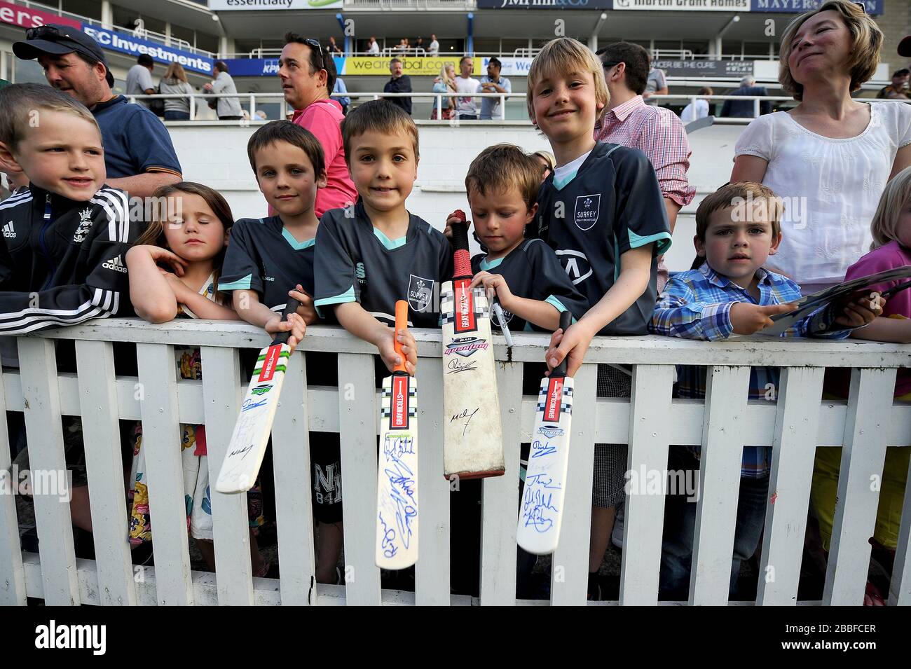 Surrey fans wait by the side of the pitch to get autographs from the ...