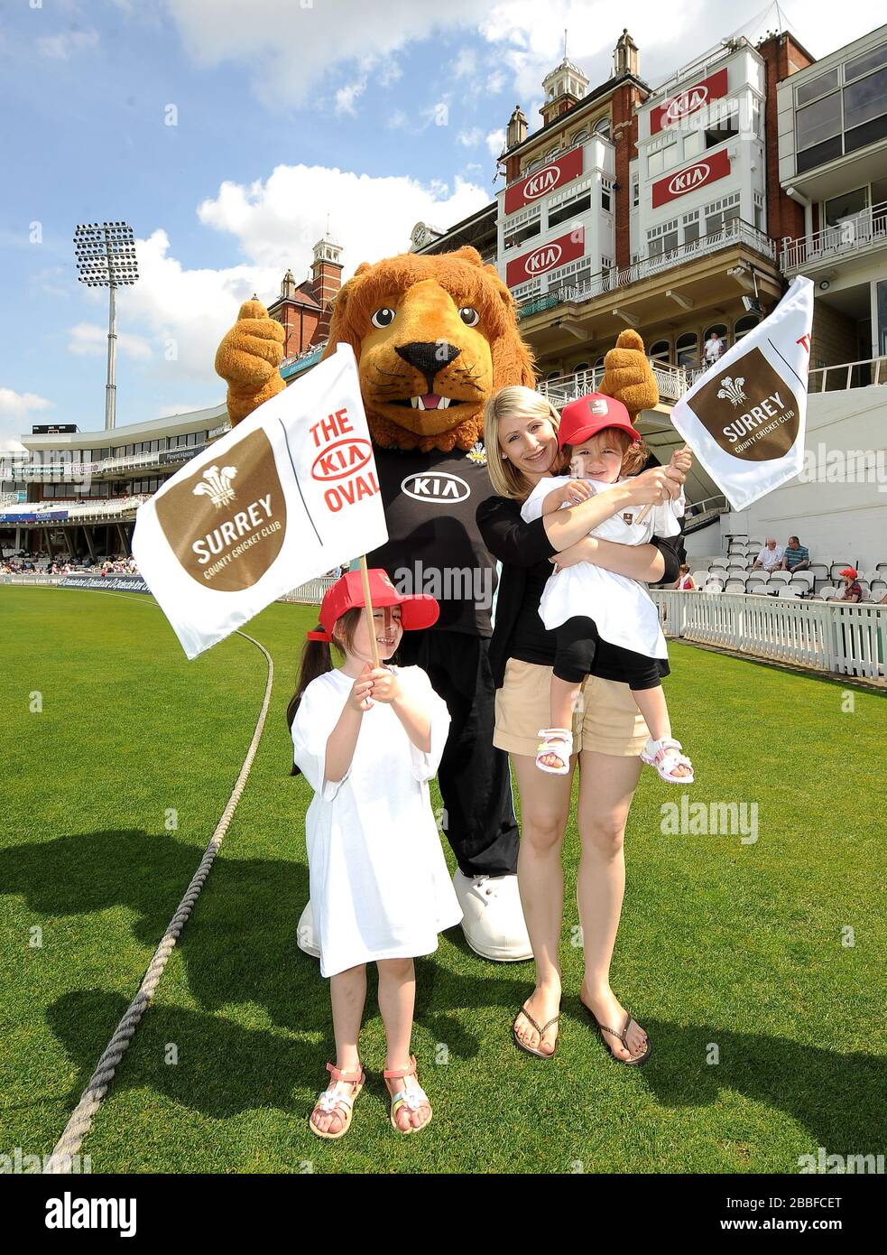 Surrey mascot Caesar the Lion with fans on the pitch Stock Photo - Alamy