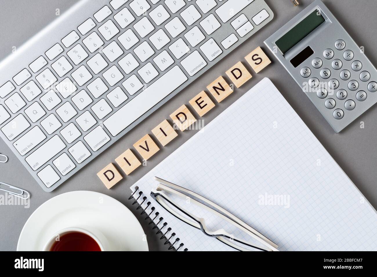 Dividends payment concept with letters Stock Photo - Alamy