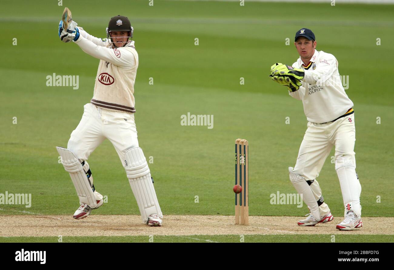 Surrey's Steven Davies hits past Durham's wicketkeeper Philip Mustard ...