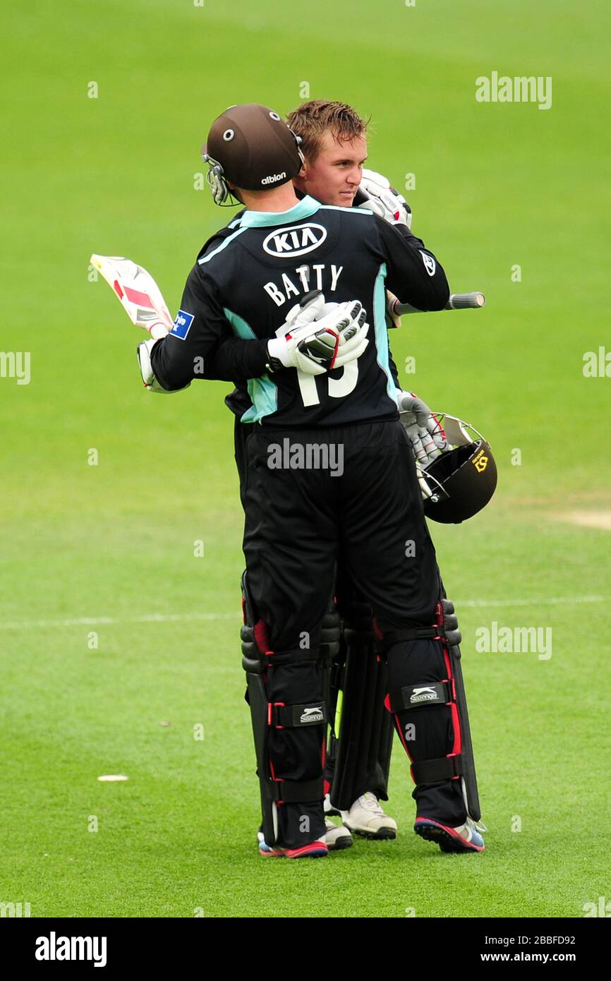 Surrey's Jason Roy celebrates his century with teammate Gareth Batty ...