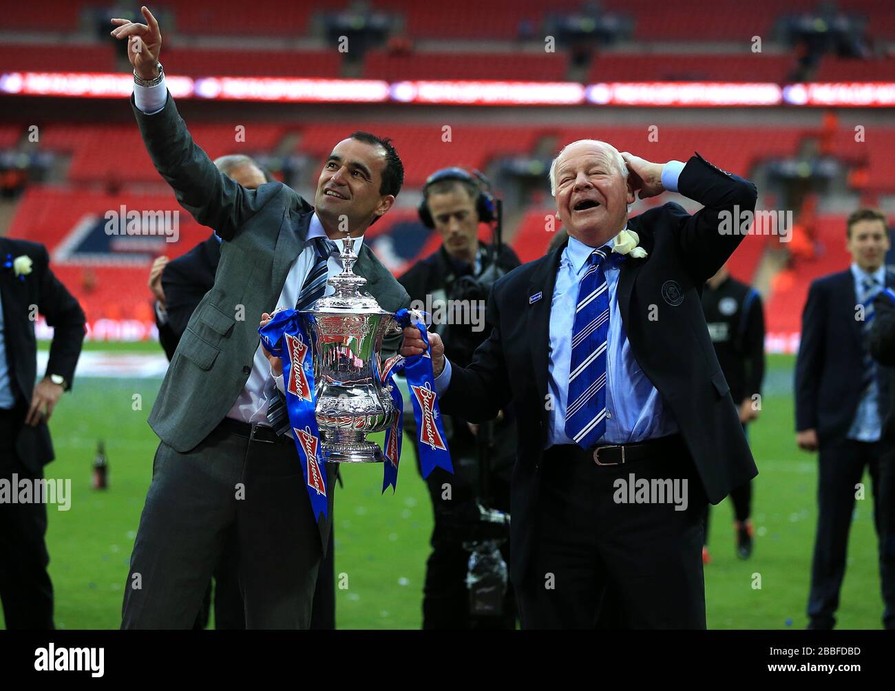Wigan Athletic Chairman Dave Whelan walks around the pitch with manager ...