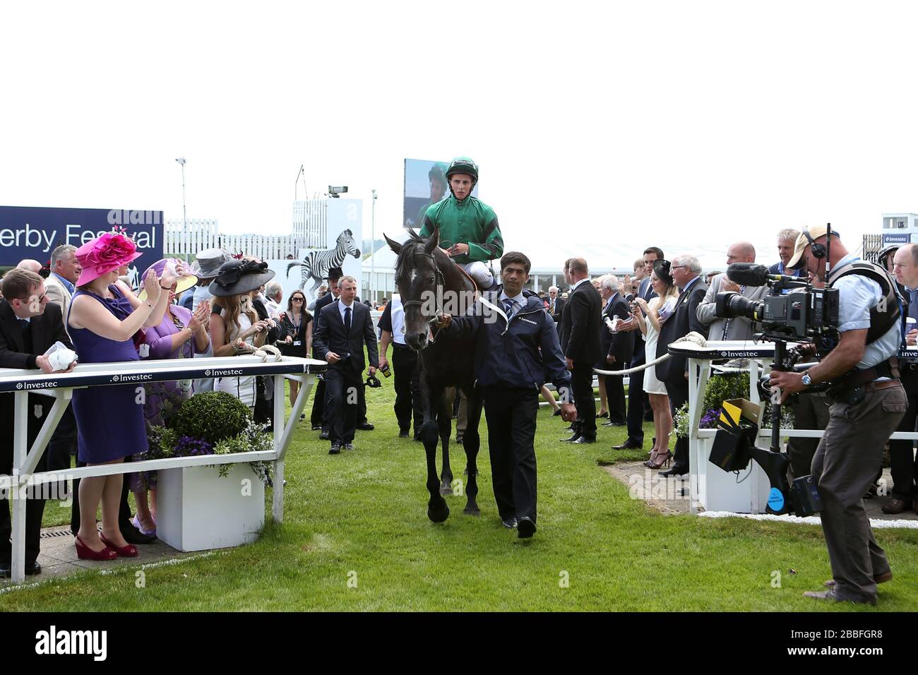 Jockey William Buick (centre) after winning the Investec Diomed Stakes ...
