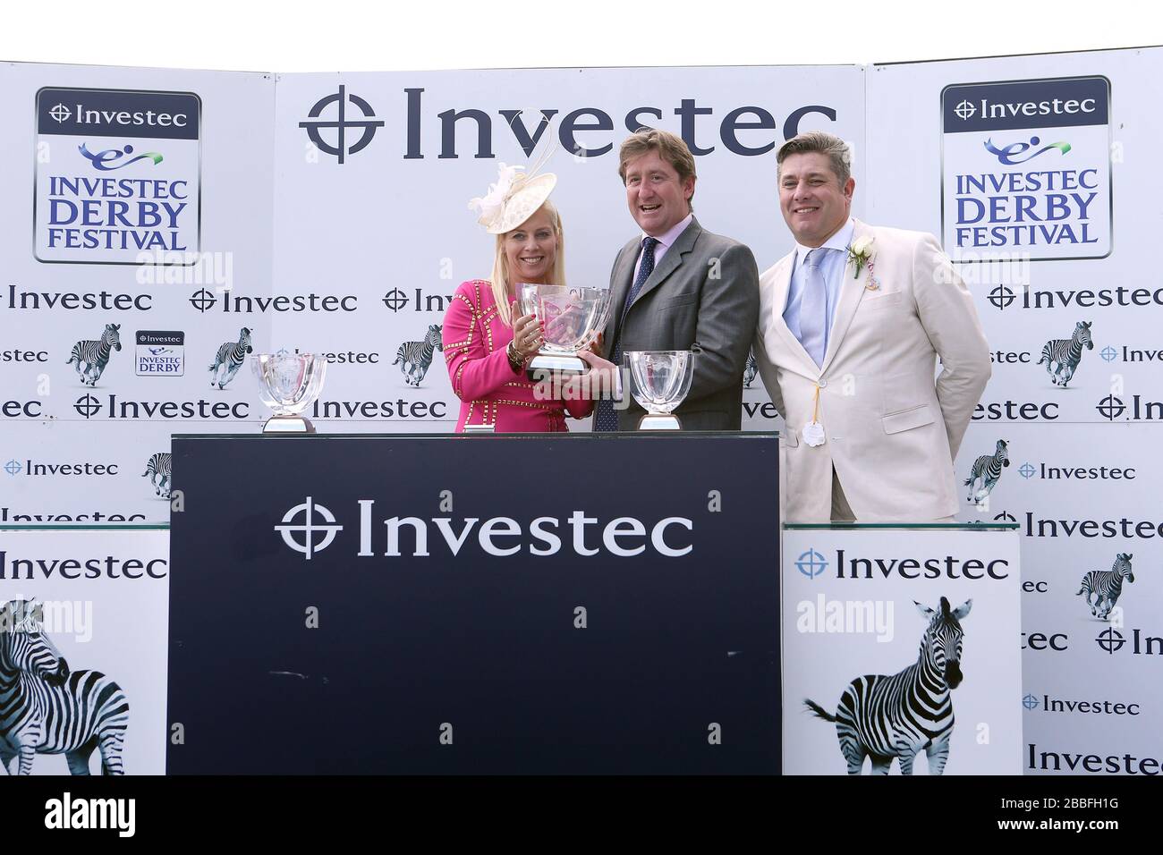 Trainer David Simcock (centre) after winning the Investec Mile with ...
