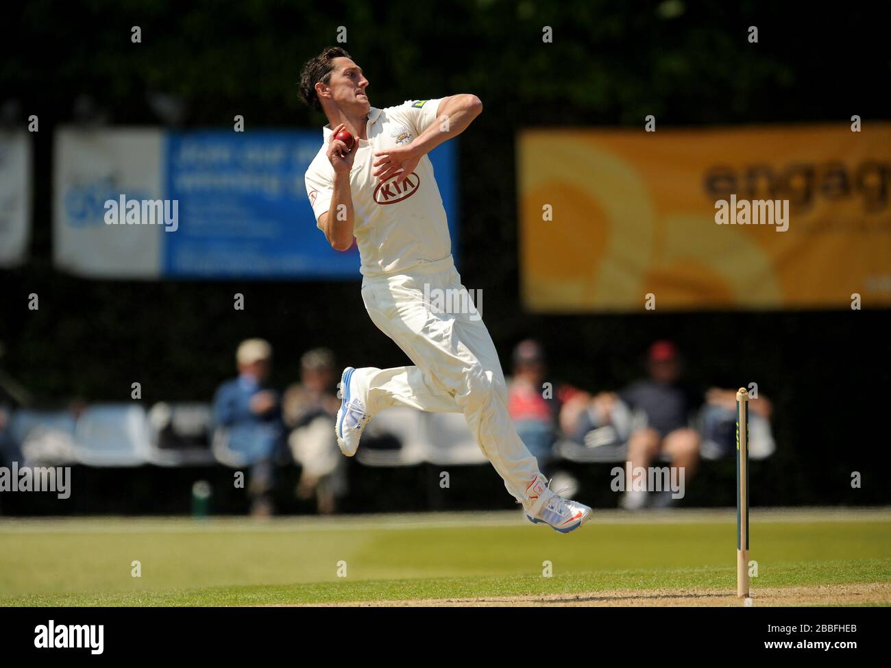 Surrey's Jon Lewis bowls Stock Photo - Alamy