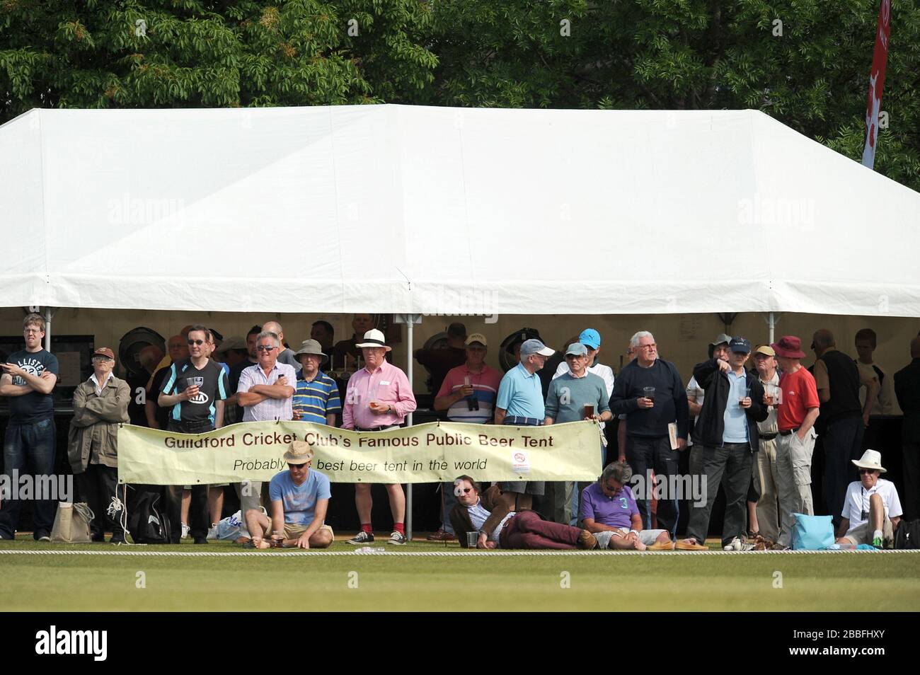 Spectators watch the action from the beer tent, just beyond the ...