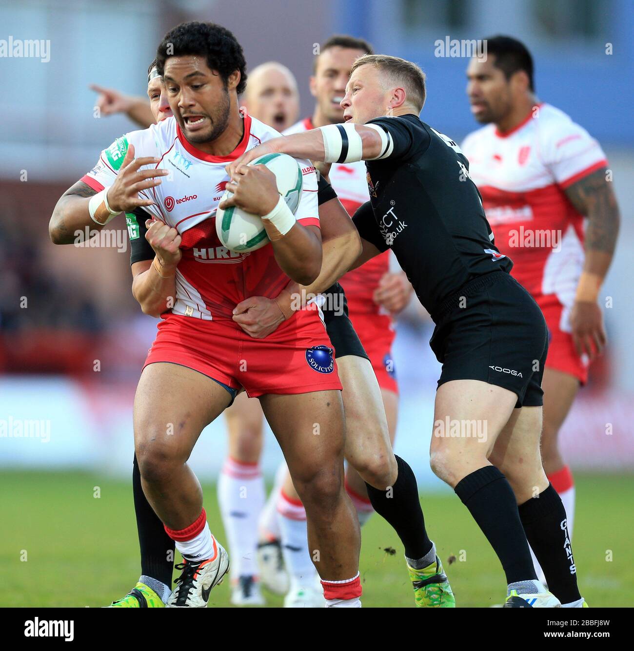 Hull KR's Con Mika and Huddersfield Giants' Shaun Lunt and Luke ...